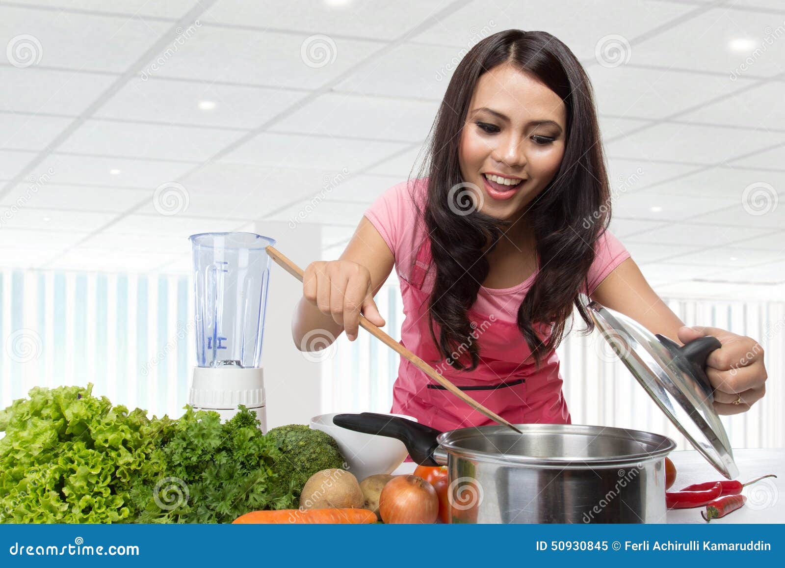 Young wife cooking stock image. Image of background, adult - 50930845