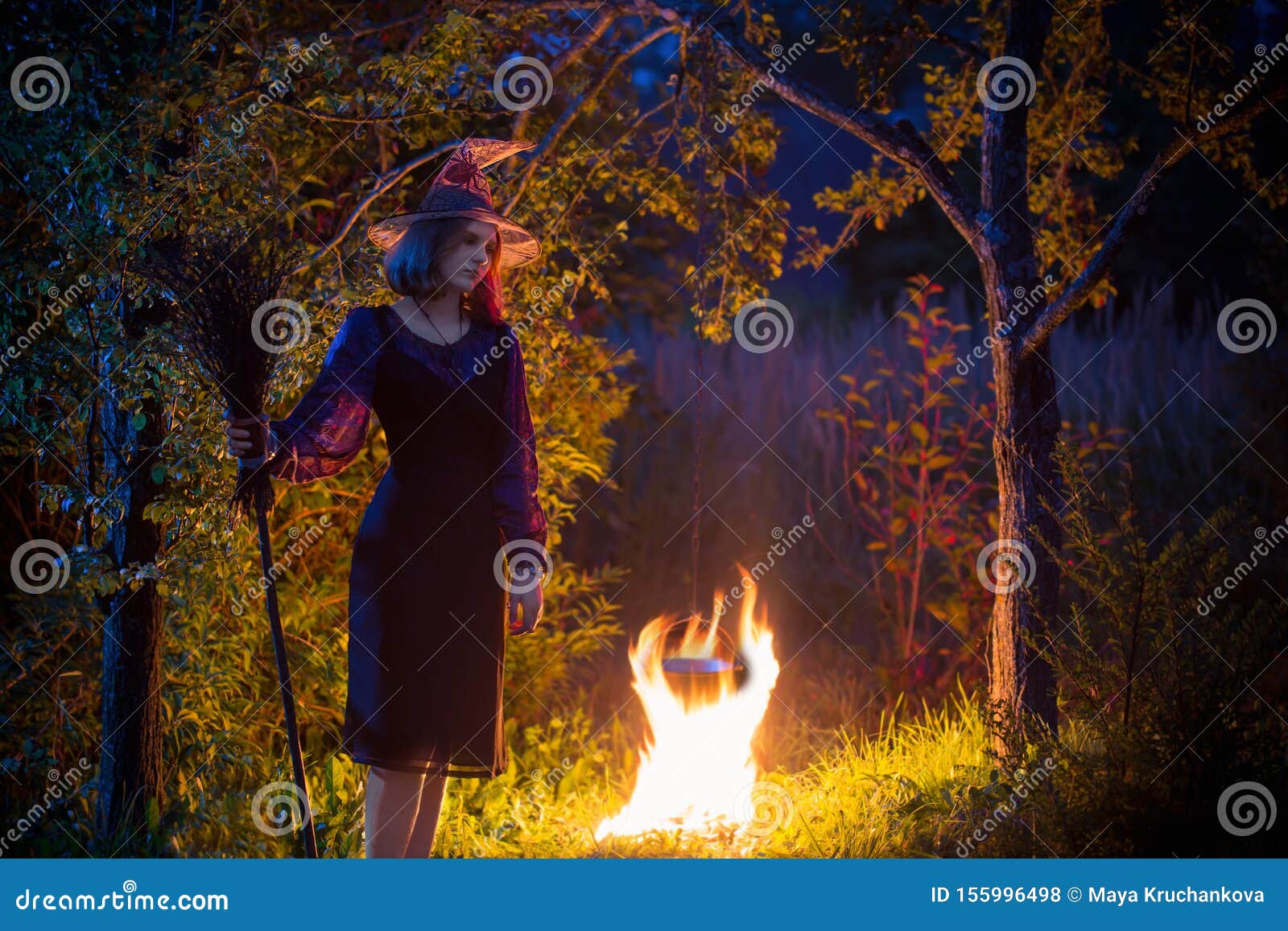 Young Witch by Fire in Night Forest Stock Photo - Image of females ...