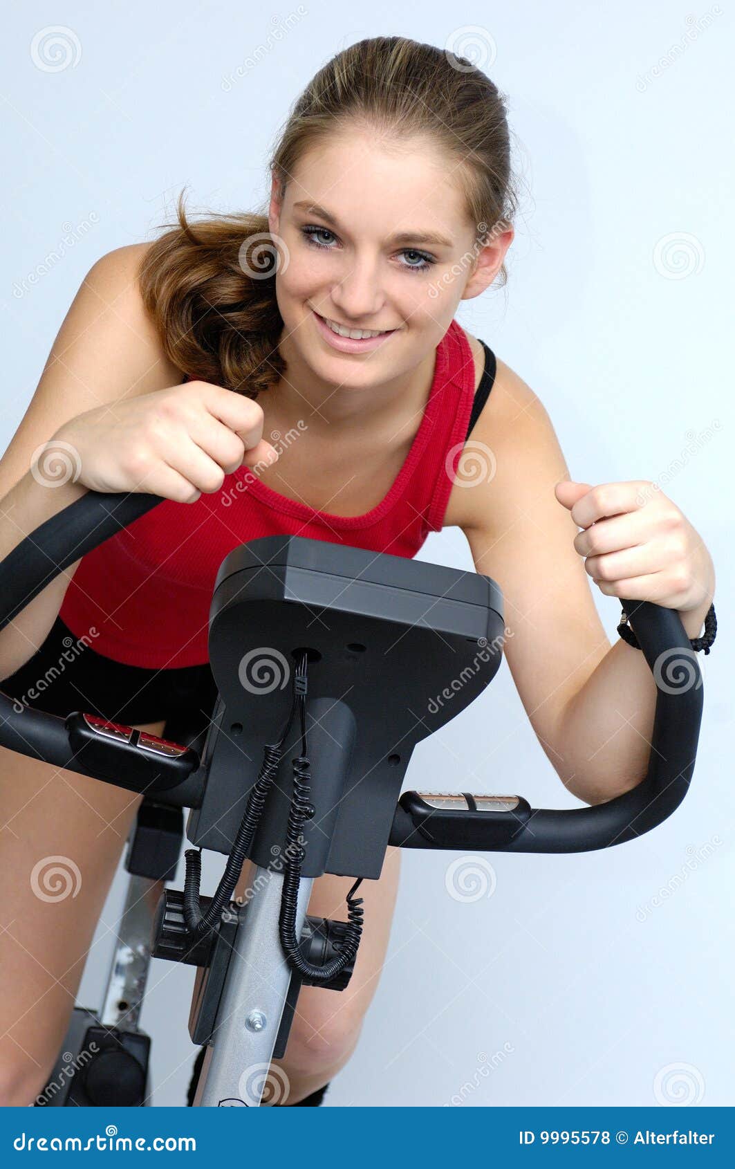 Young woman on stock photo. Image of woman, movement, ergometer - 9995578