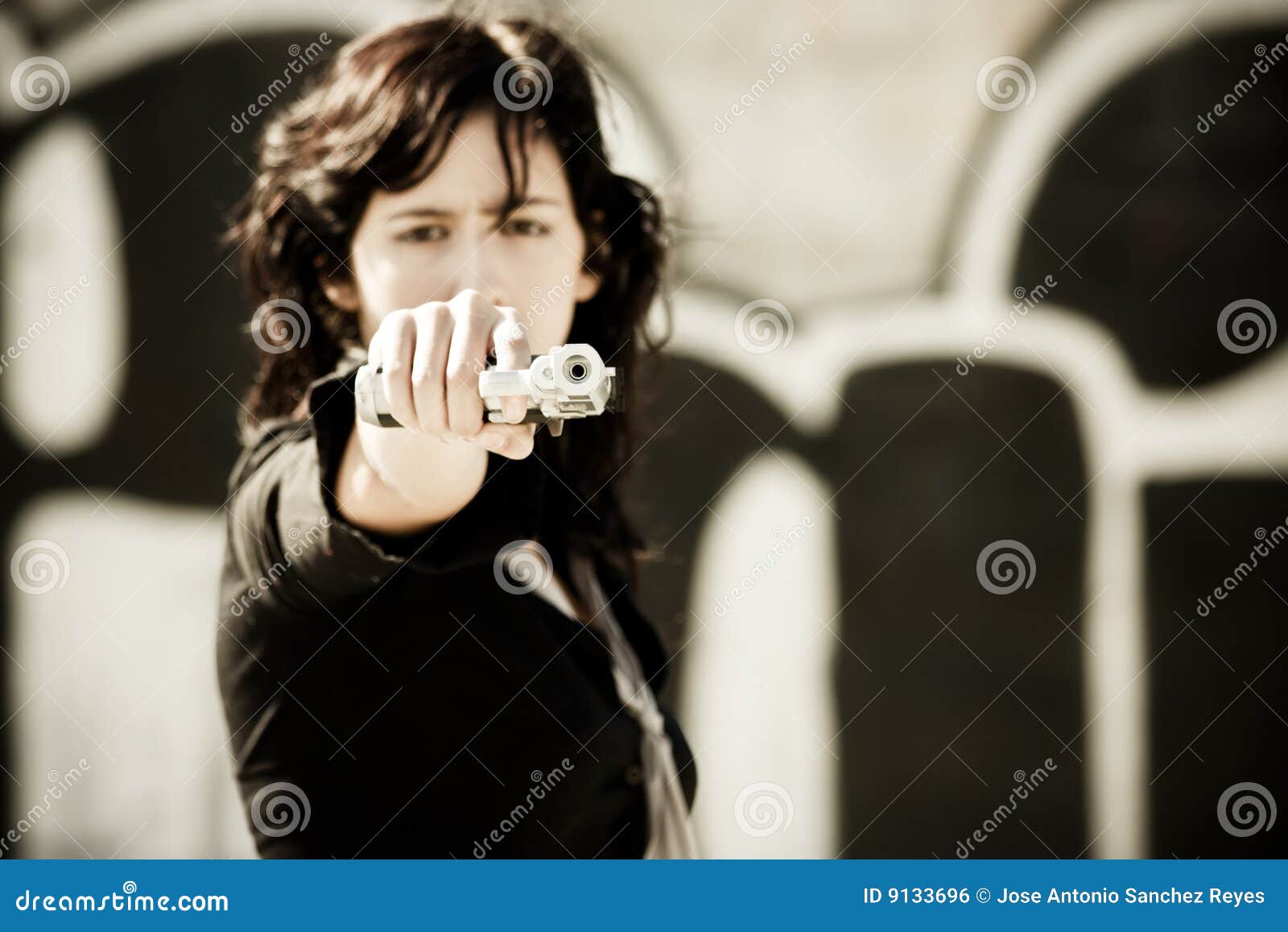 Young Woman Aiming at Camera. Stock Photo - Image of beautiful, angry ...