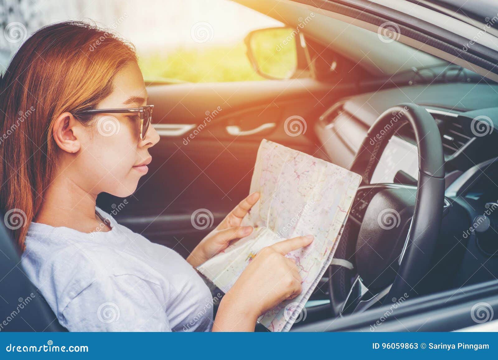 Young Woman Alone Car Traveler with Map on Hatchback Car Stock Image ...