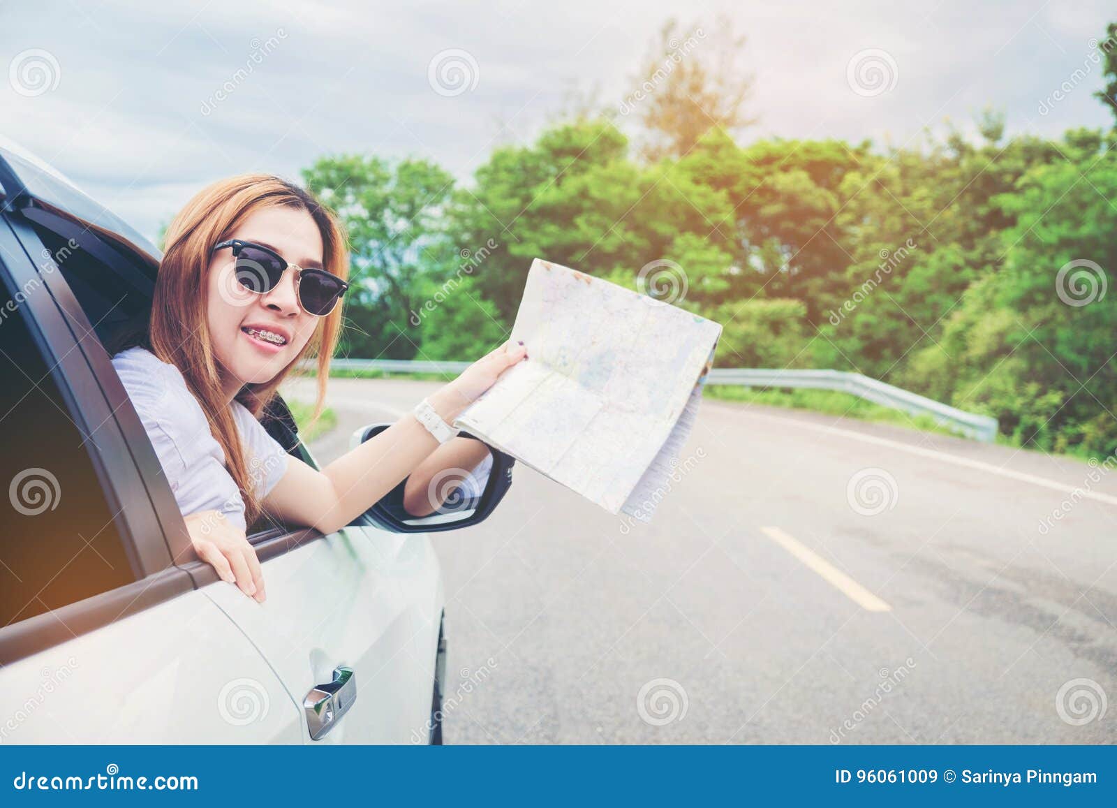 Young Woman Alone Car Traveler with Map on Hatchback Car Stock Image ...