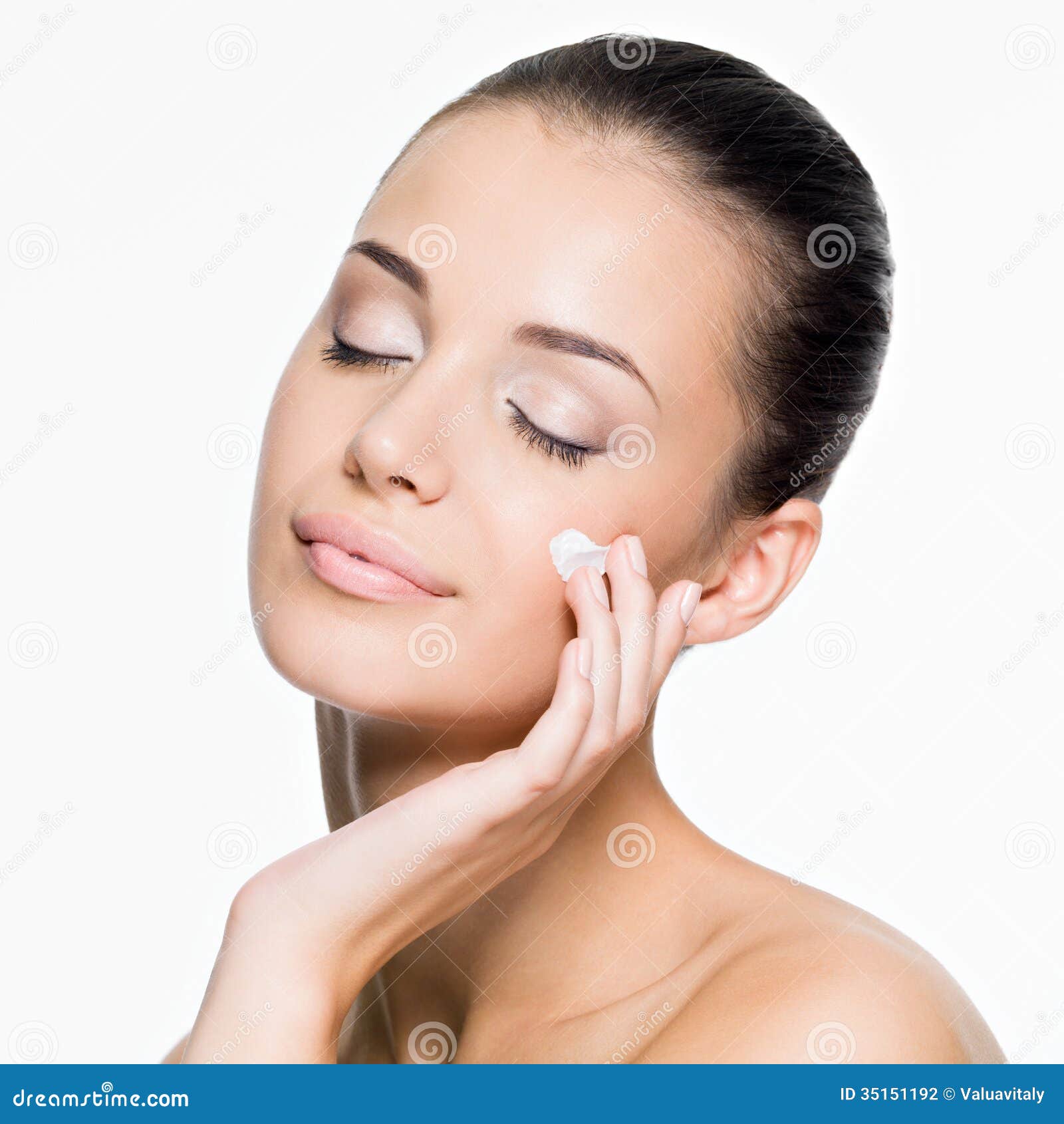Young Woman Applying Cream on Face Stock Photo - Image of female ...