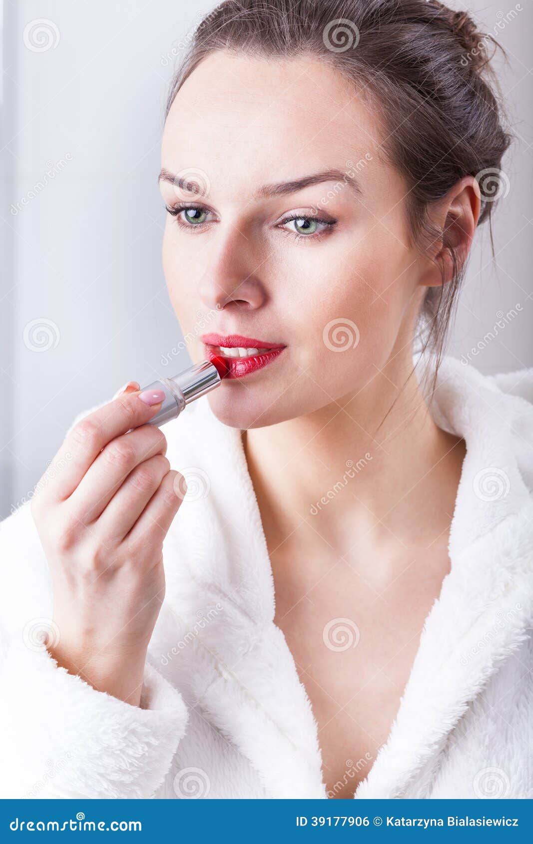 Young Woman Applying Lipstick Stock Photo - Image of purity, precisive ...