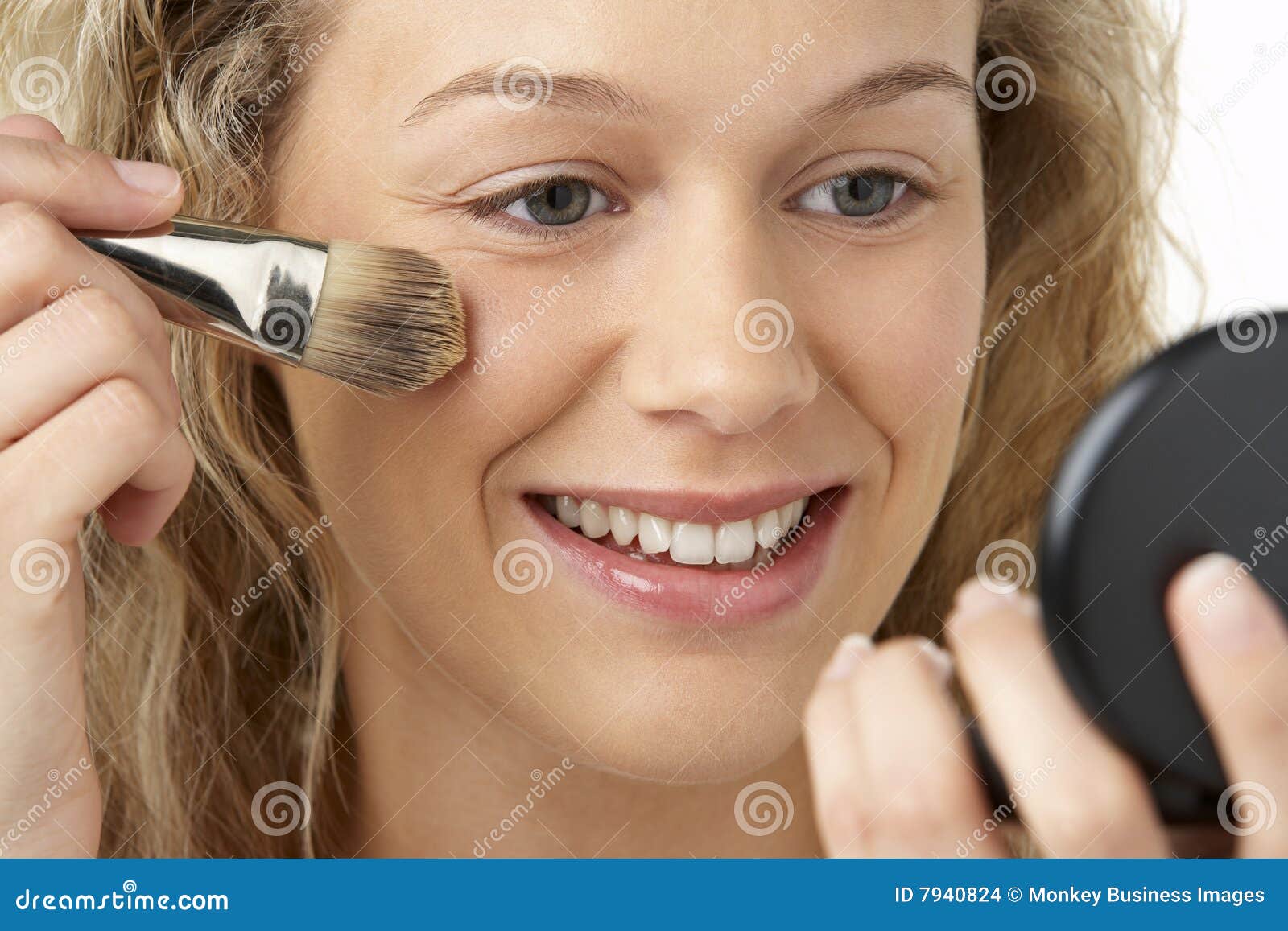 Young Woman Applying Make-Up Stock Photo - Image of head, mirror: 7940824