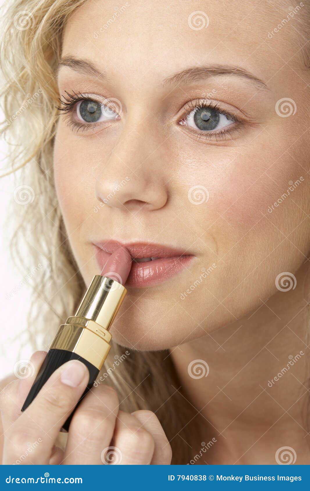 Young Woman Applying Make-Up Stock Photo - Image of caucasian, blond ...
