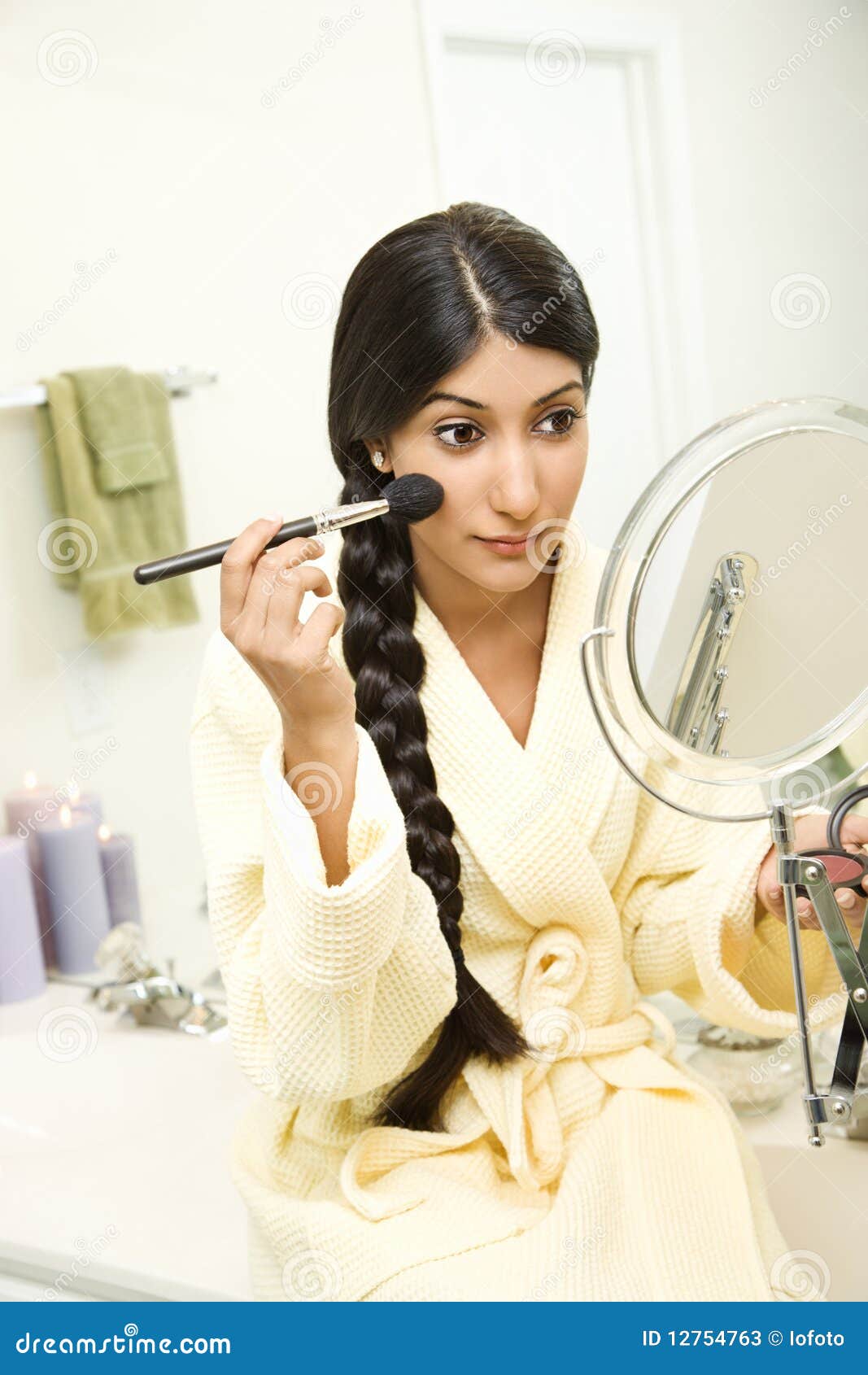 Young Woman Applying Makeup Stock Image - Image of east, camera: 12754763