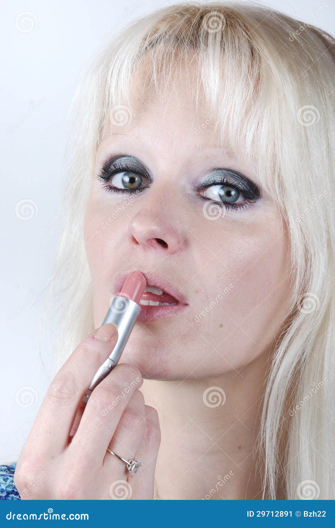 Young Woman Applying Pink Lipstick Stock Image - Image of glamour ...