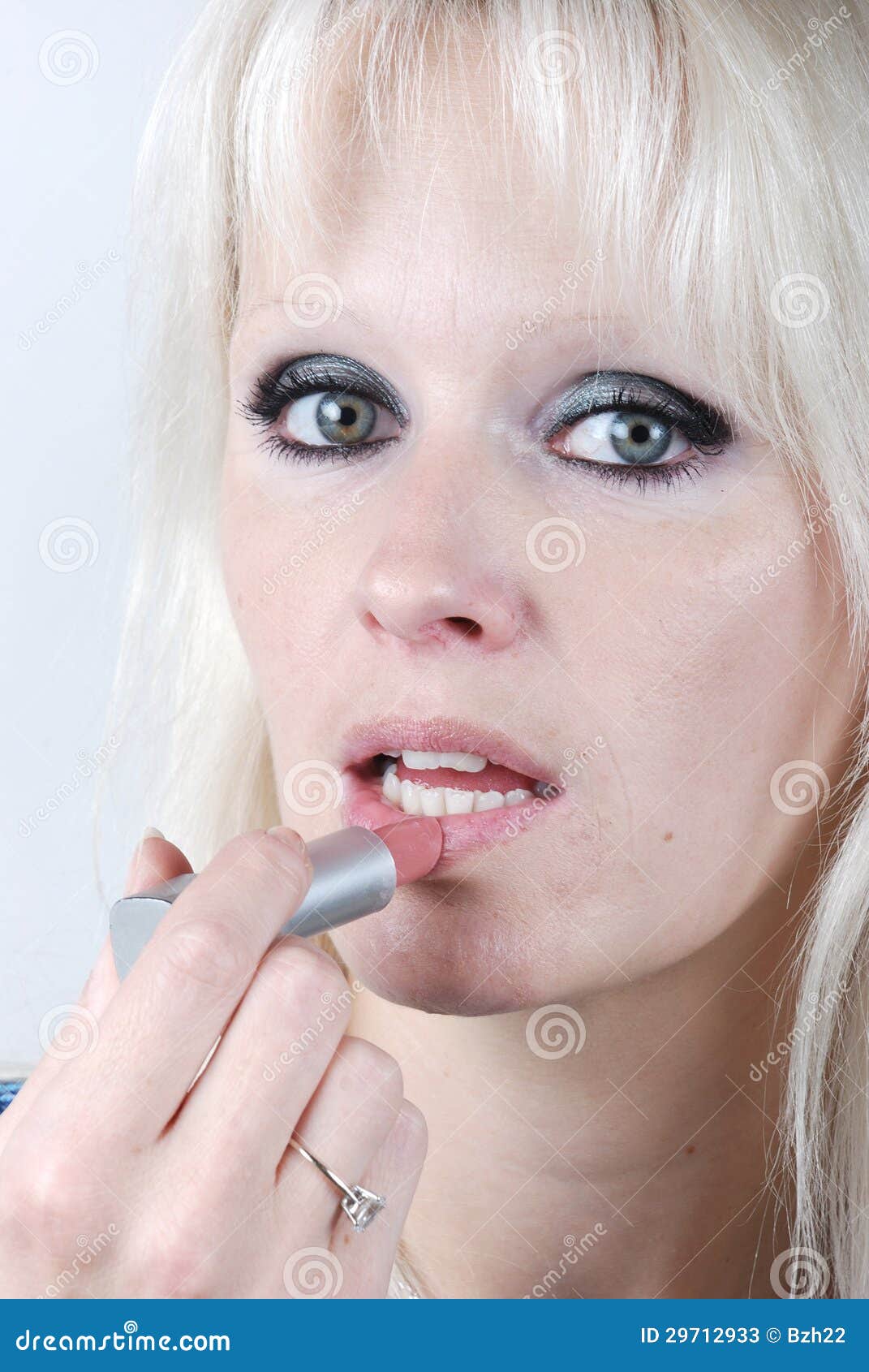 Young Woman Applying Pink Lipstick Stock Image - Image of adult, makeup ...