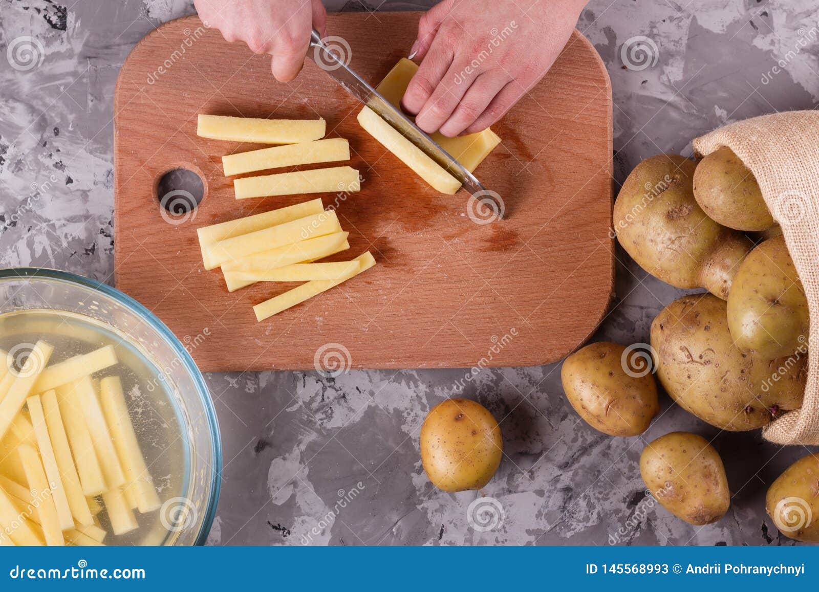 Young Woman in an Apron Cuts Potatoes Stock Image - Image of potatoes ...