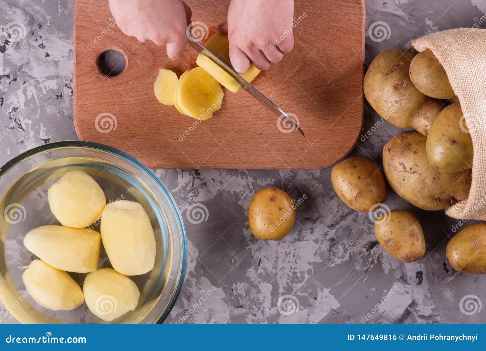 Young Woman in an Apron Cuts Potatoes Stock Photo - Image of view ...
