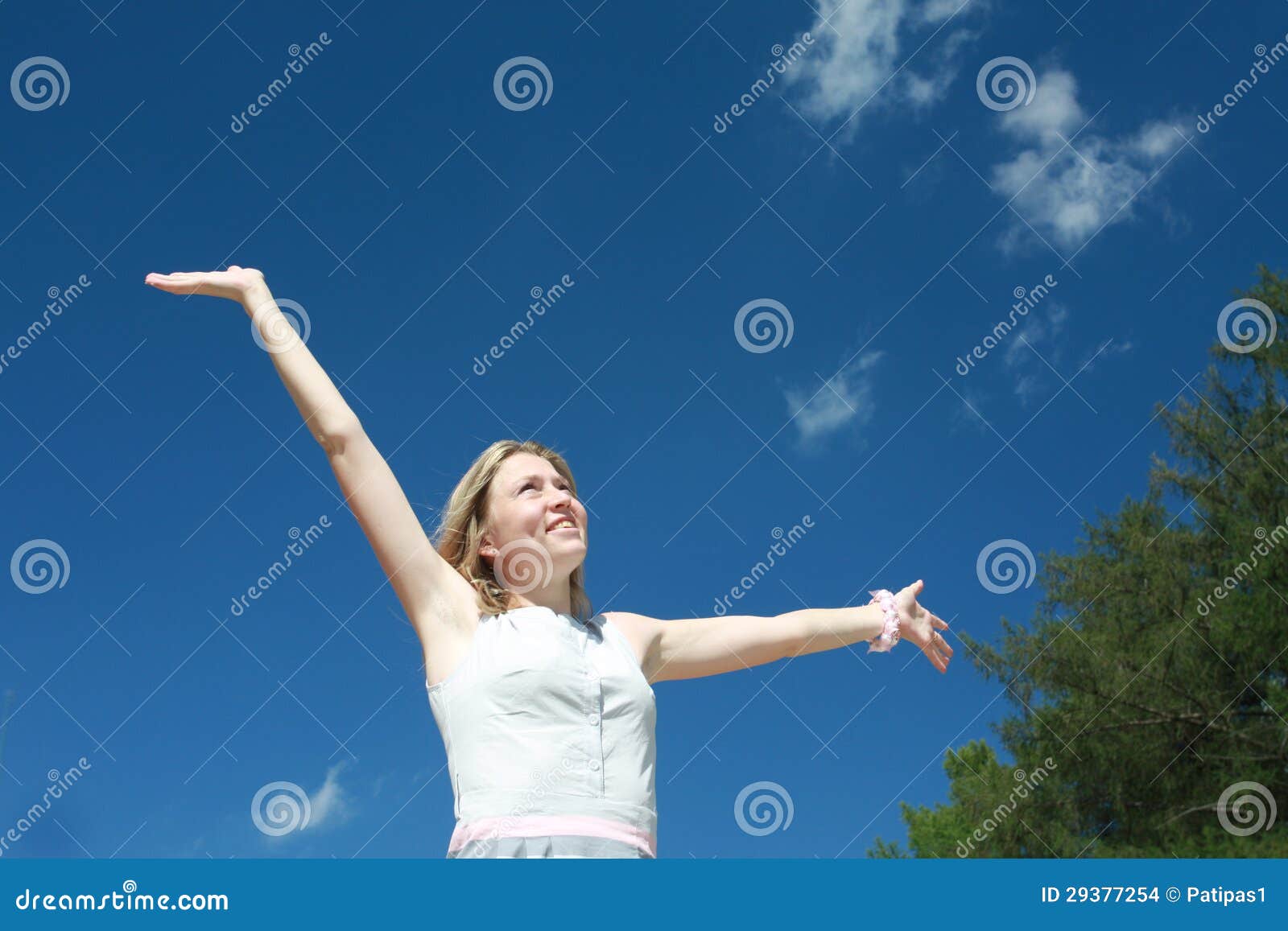 Young Woman with Arms Raised Stock Photo - Image of smile, cheerful ...