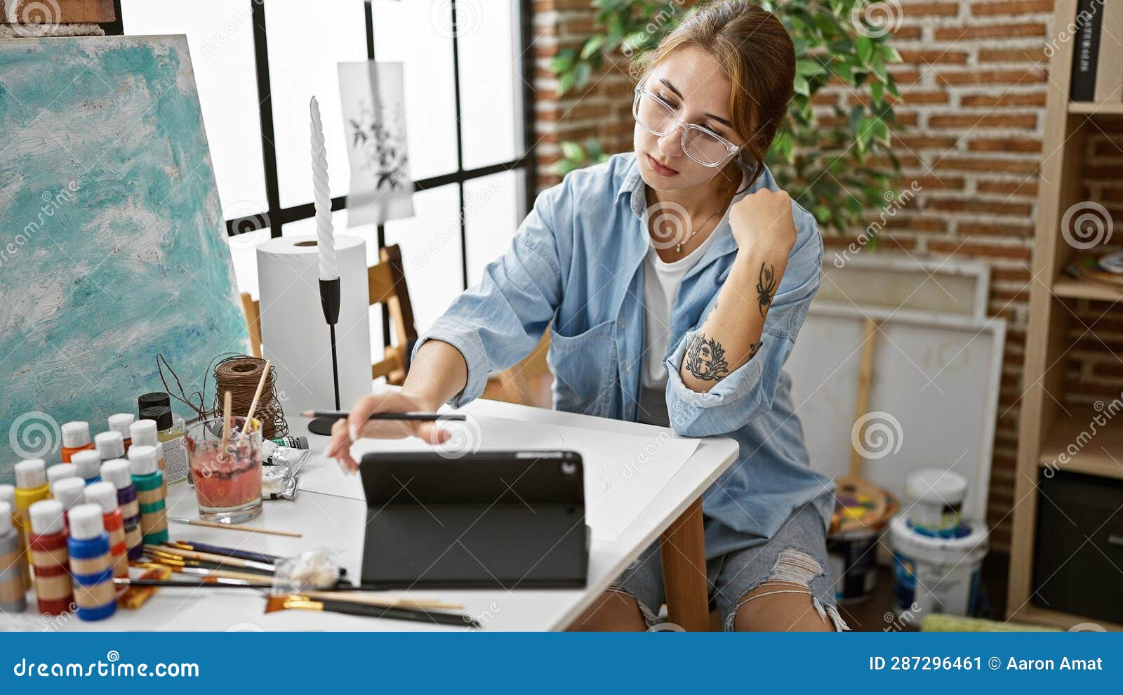 Young Woman Artist Drawing on Paper Using Touchpad at Art Studio Stock ...