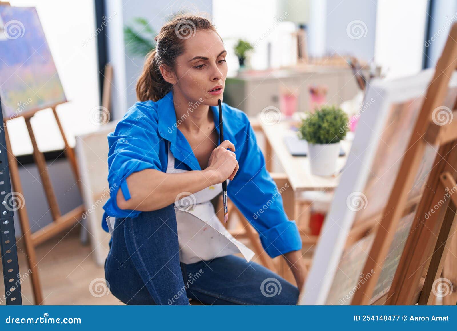 Young Woman Artist Looking Draw with Doubt Expression at Art Studio ...
