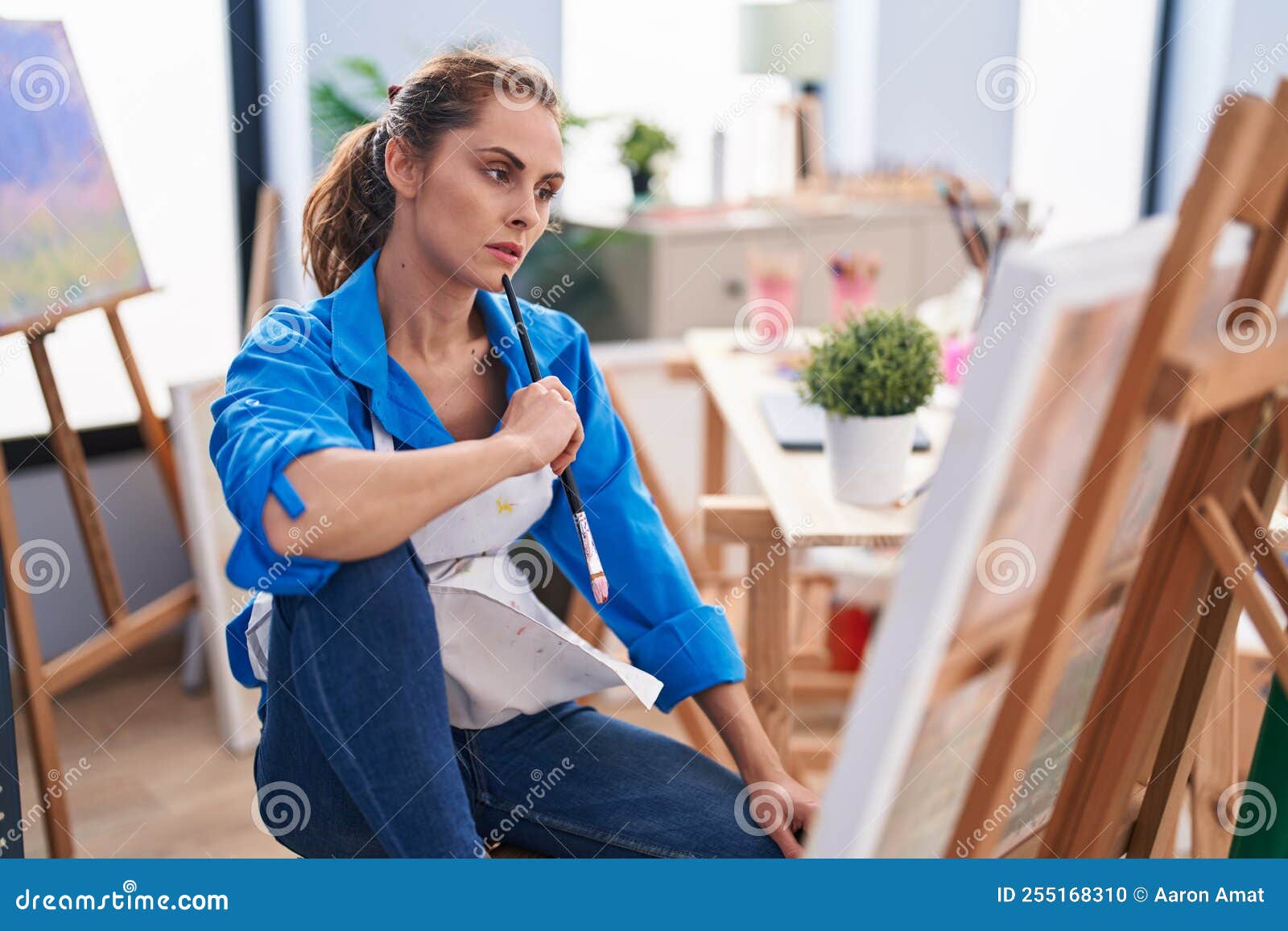 Young Woman Artist Looking Draw with Doubt Expression at Art Studio ...