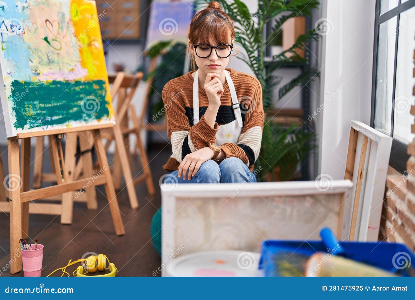 Young Woman Artist Looking Draw with Doubt Expression at Art Studio ...