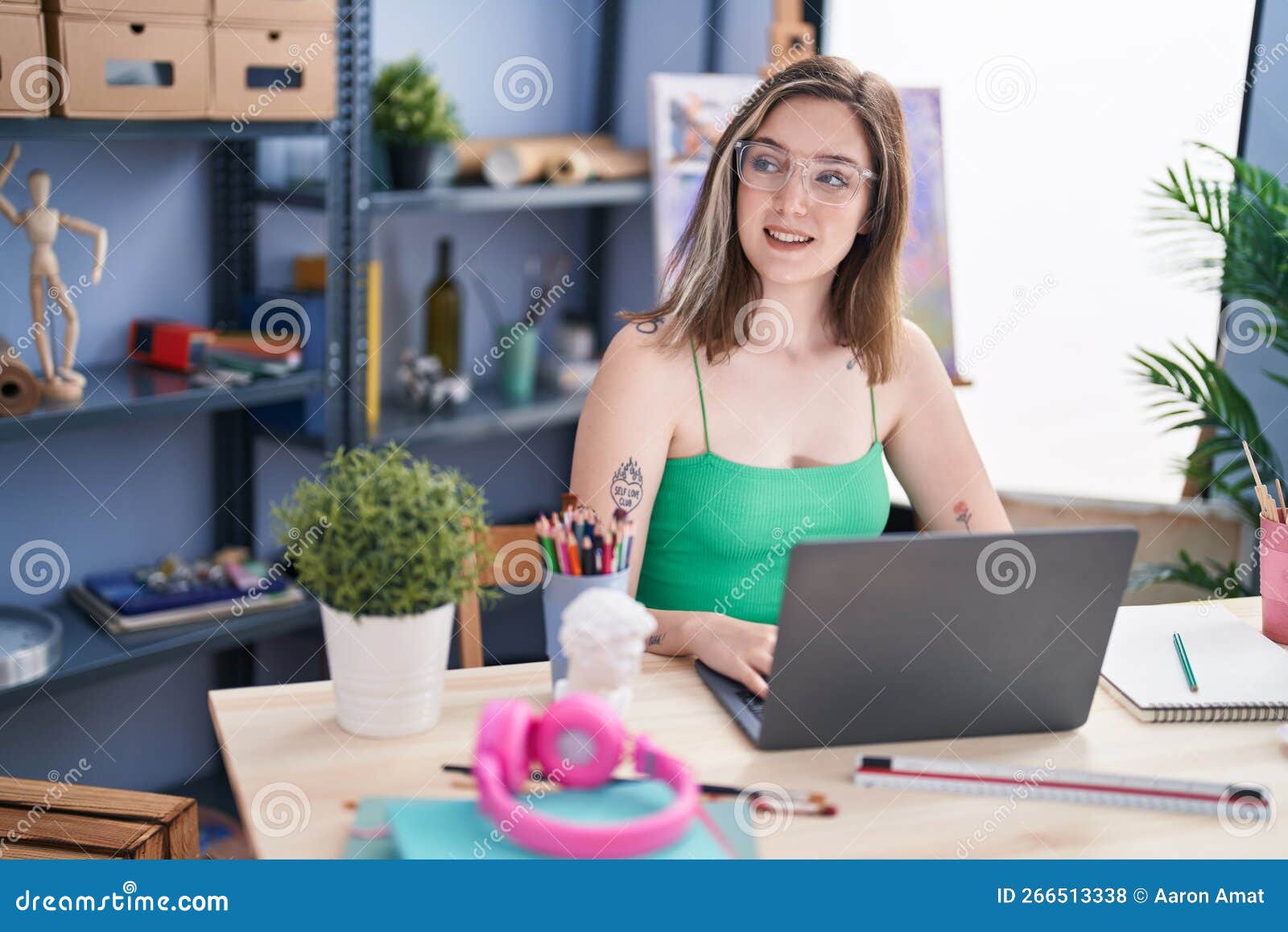 Young Woman Artist Using Laptop Sitting on Table at Art Studio Stock ...