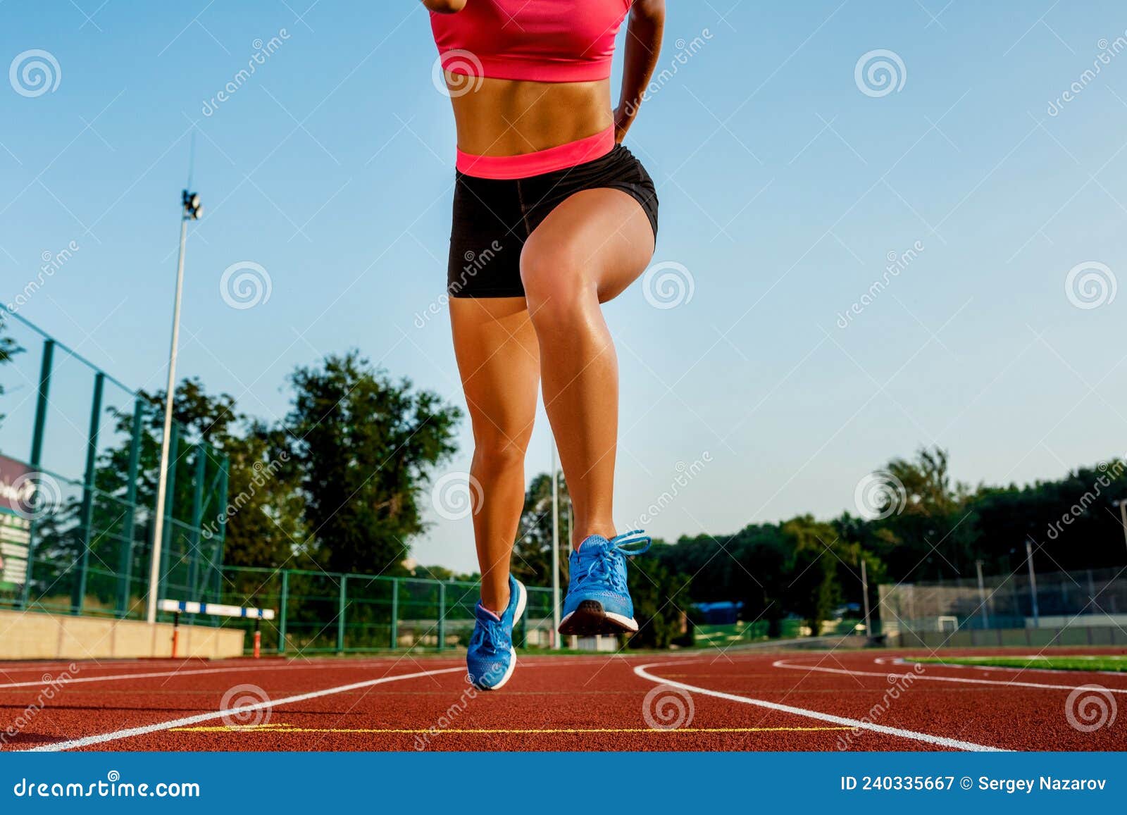 Young Woman Athlete At Starting Position Ready To Start A Race On