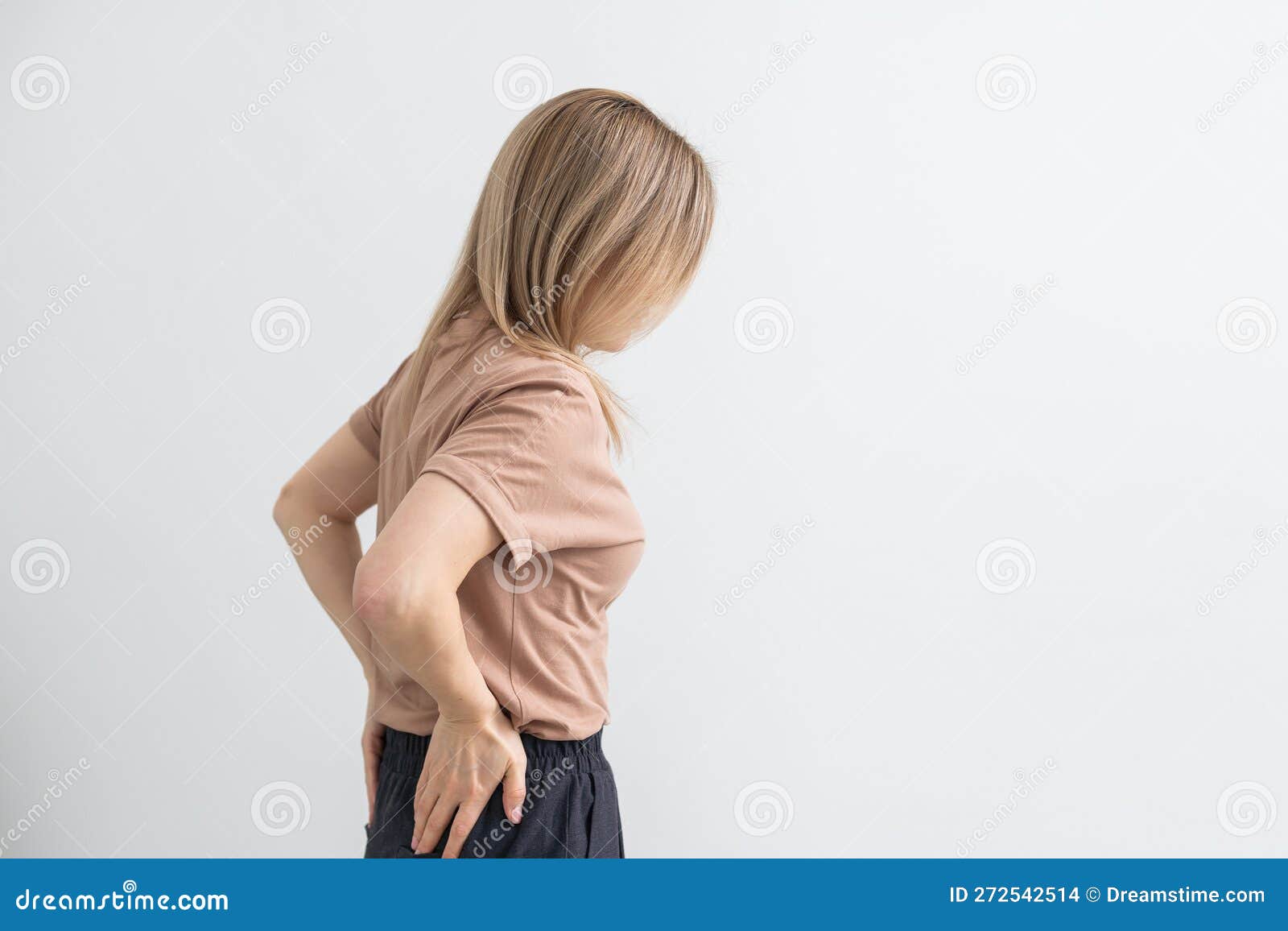 Young woman with back pain stock photo. Image of health - 272542514