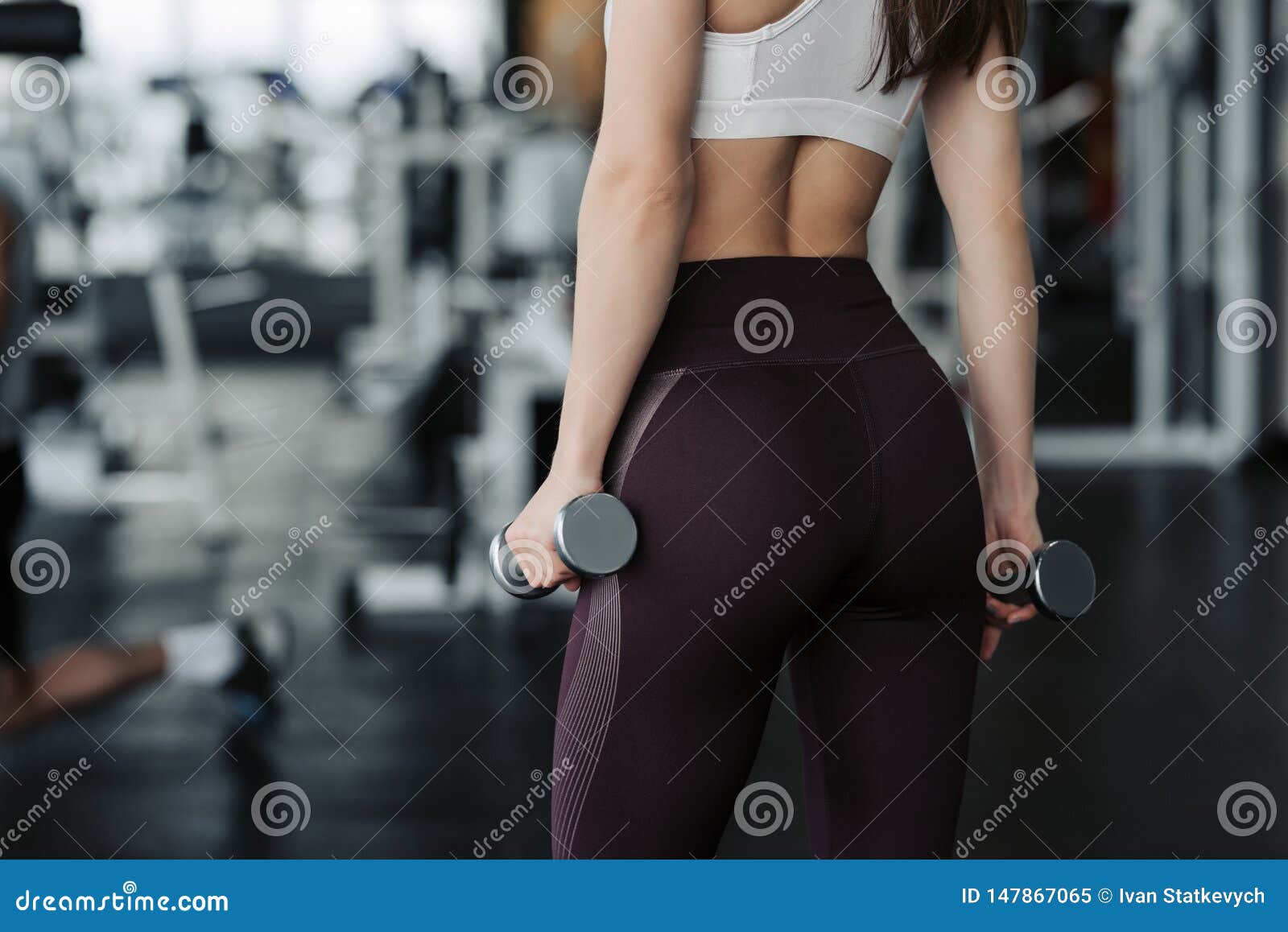 Young Woman Back Training with Dumbbells in the Gym Stock Image - Image ...