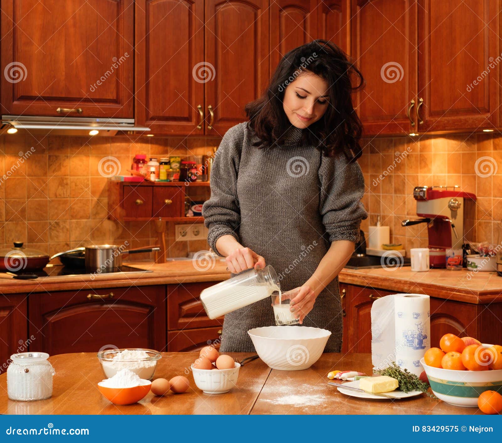 Young woman baking at home stock image. Image of domestic - 83429575