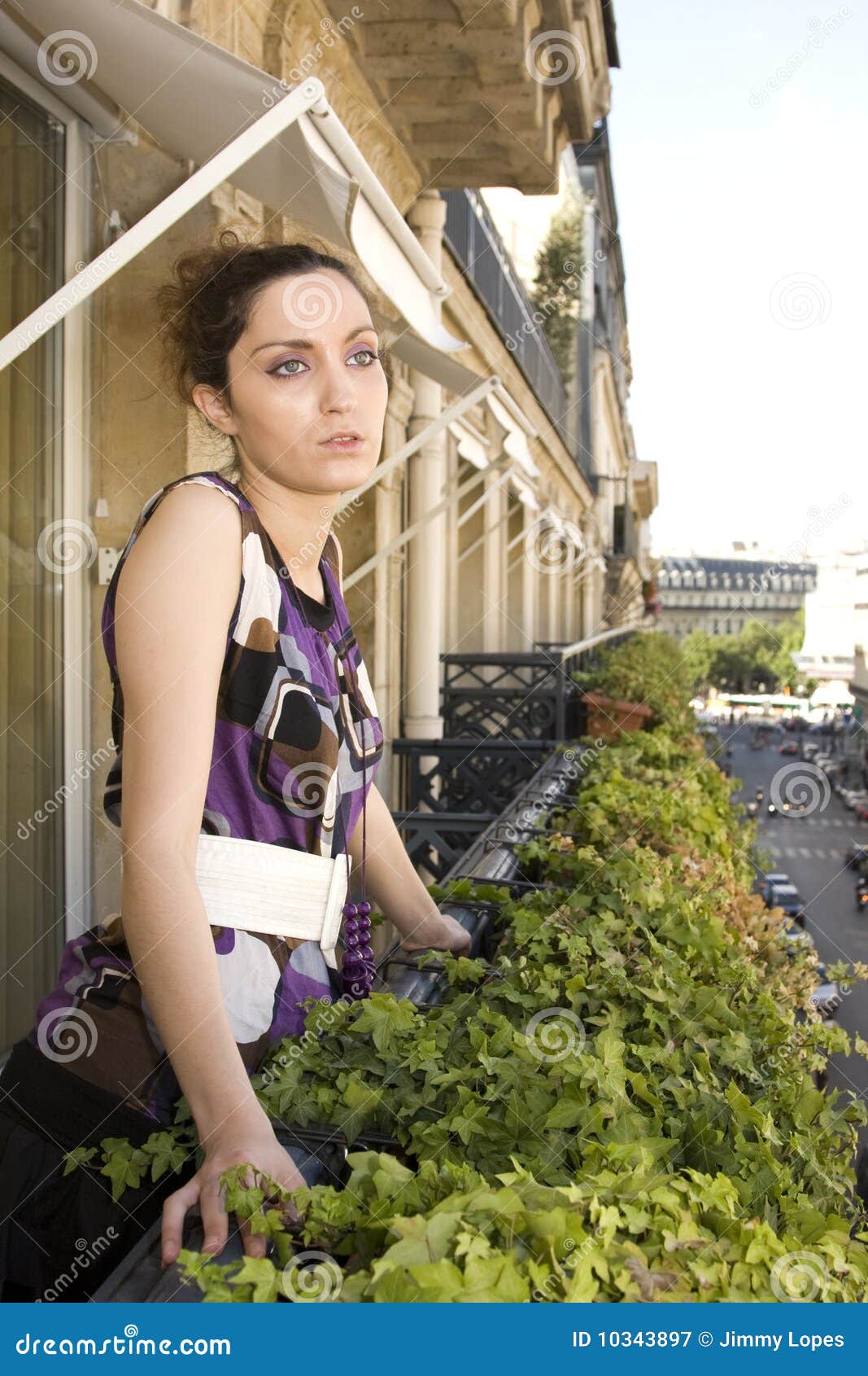 Young Woman on Balcony stock image. Image of brown, dress - 10343897
