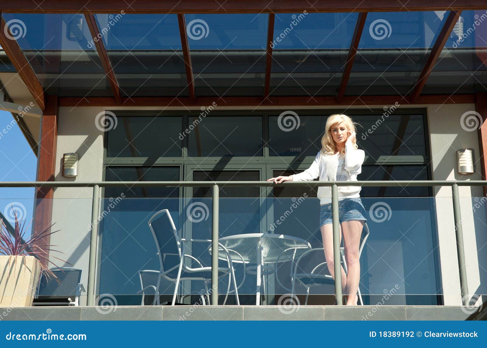Young woman on balcony stock photo. Image of look, modern - 18389192