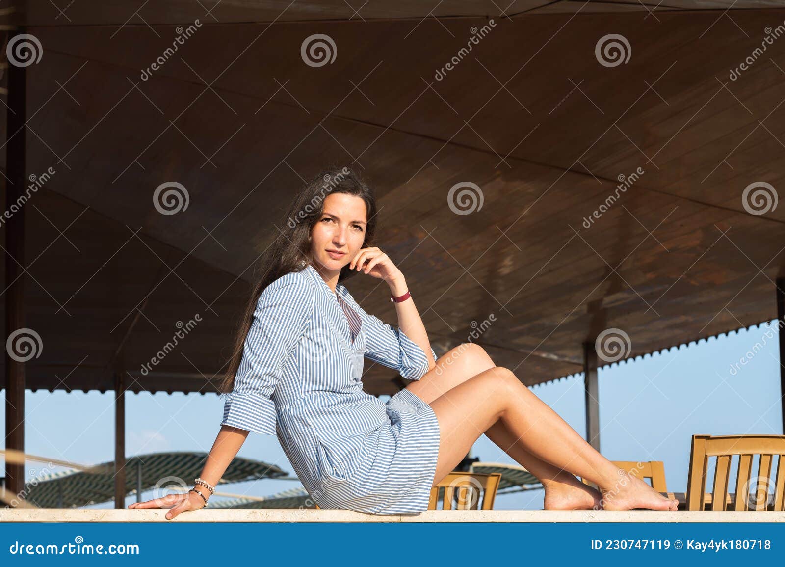 Young Woman Basking in the Sun Stock Image - Image of bask, girl: 230747119