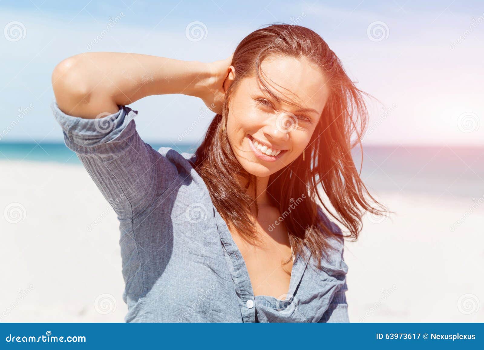 Young woman at the beach stock image. Image of person - 63973617