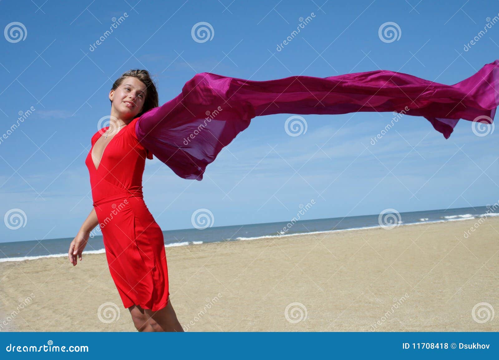 Young Woman on Beach with Red Fluttering Scarf Stock Photo - Image of ...