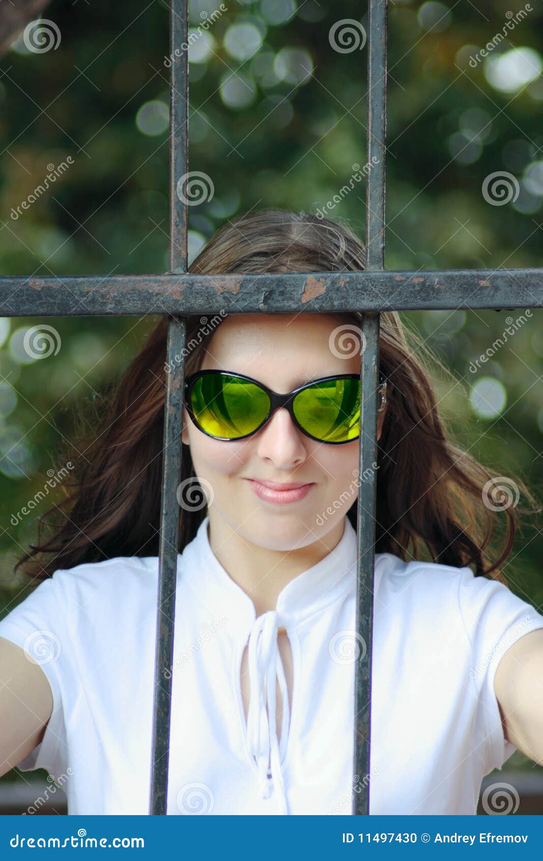 The Young Woman Behind an Iron Protection Stock Photo - Image of ...