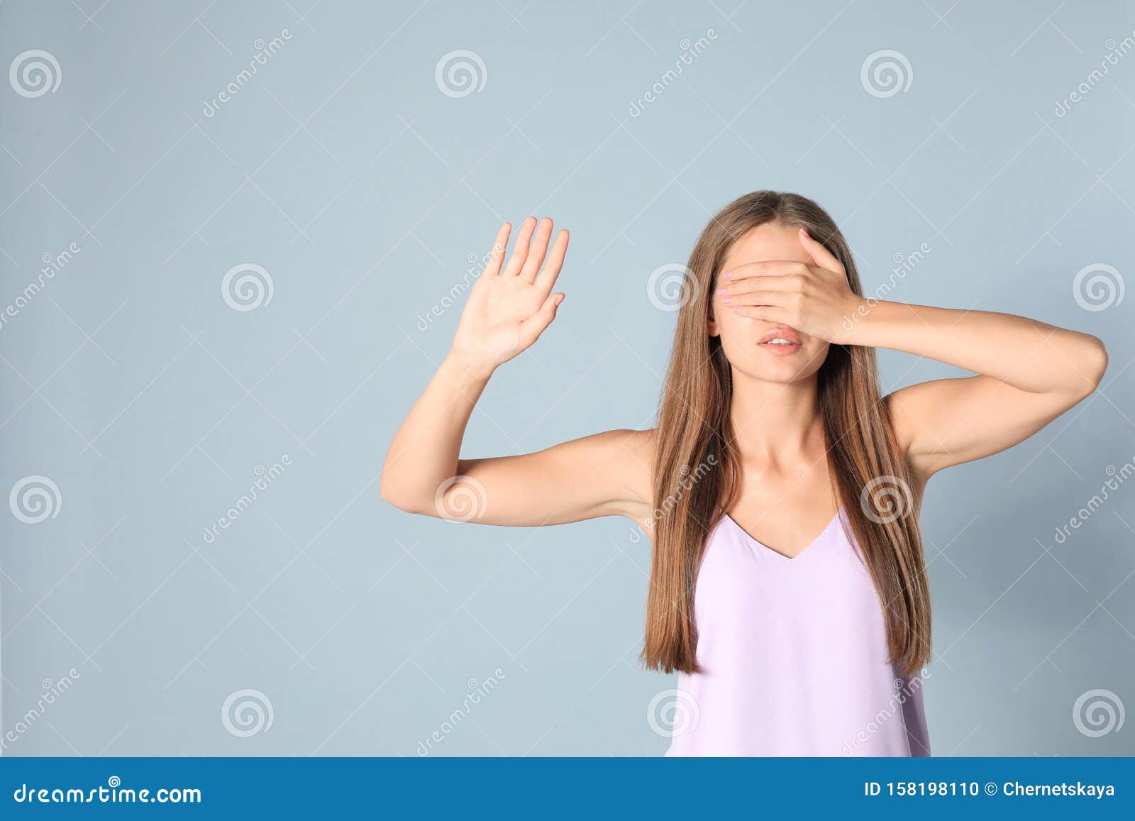 Young Woman Being Blinded on Grey Background Stock Photo - Image of ...
