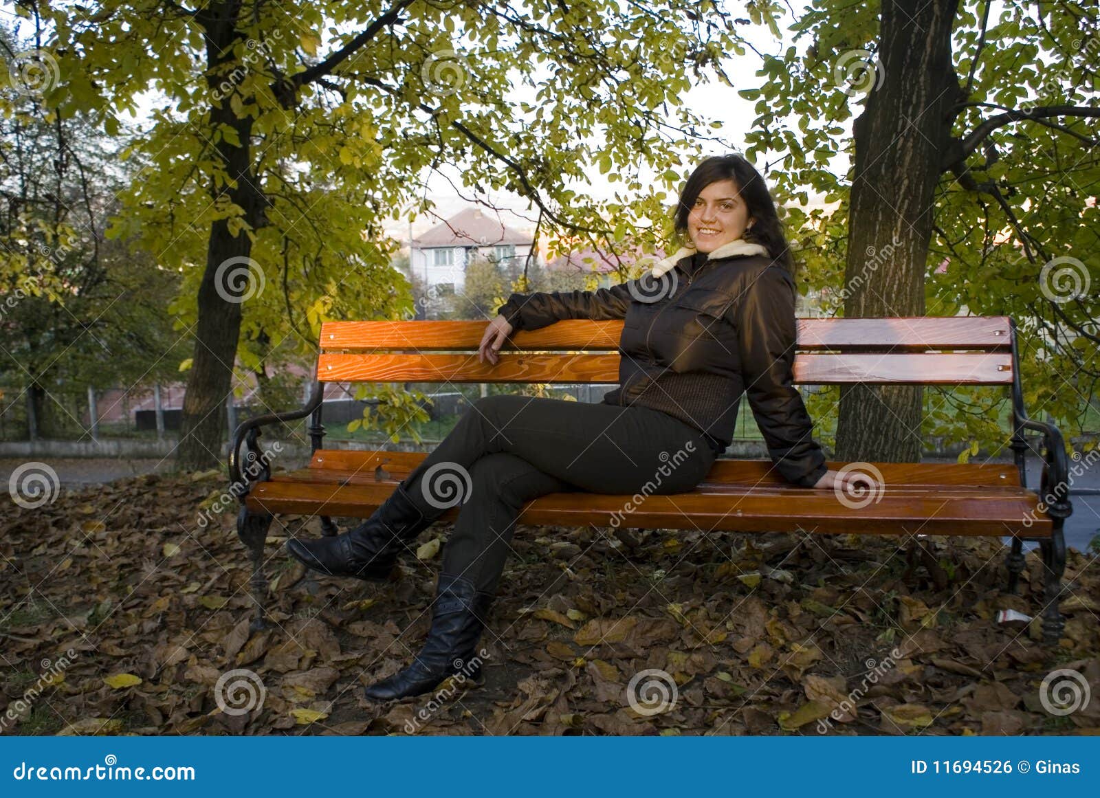 Young woman on a bench stock photo. Image of hair, face - 11694526