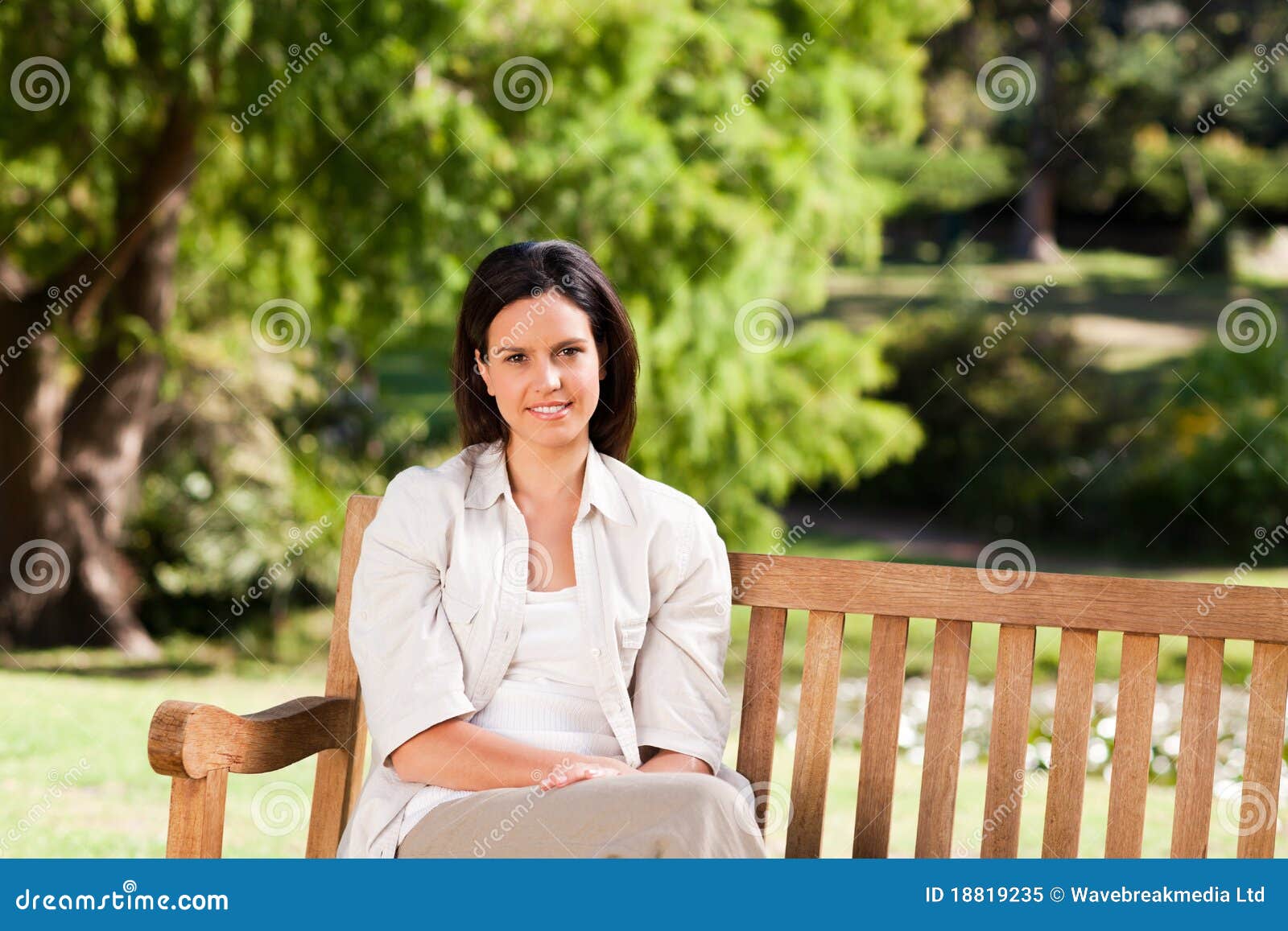 Young woman on the bench stock image. Image of garden - 18819235