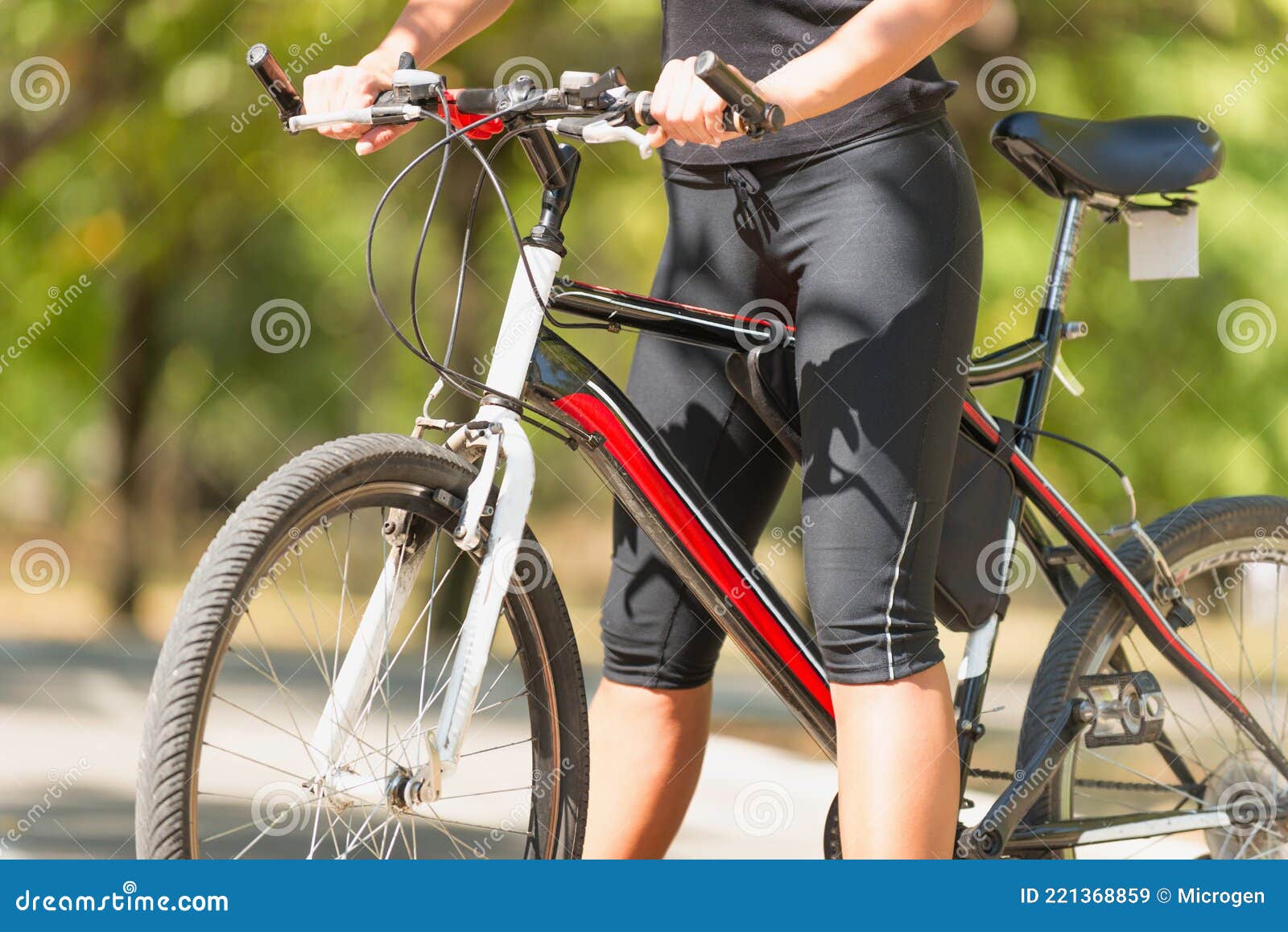 Young woman on bicycle stock image. Image of horizontal - 221368859