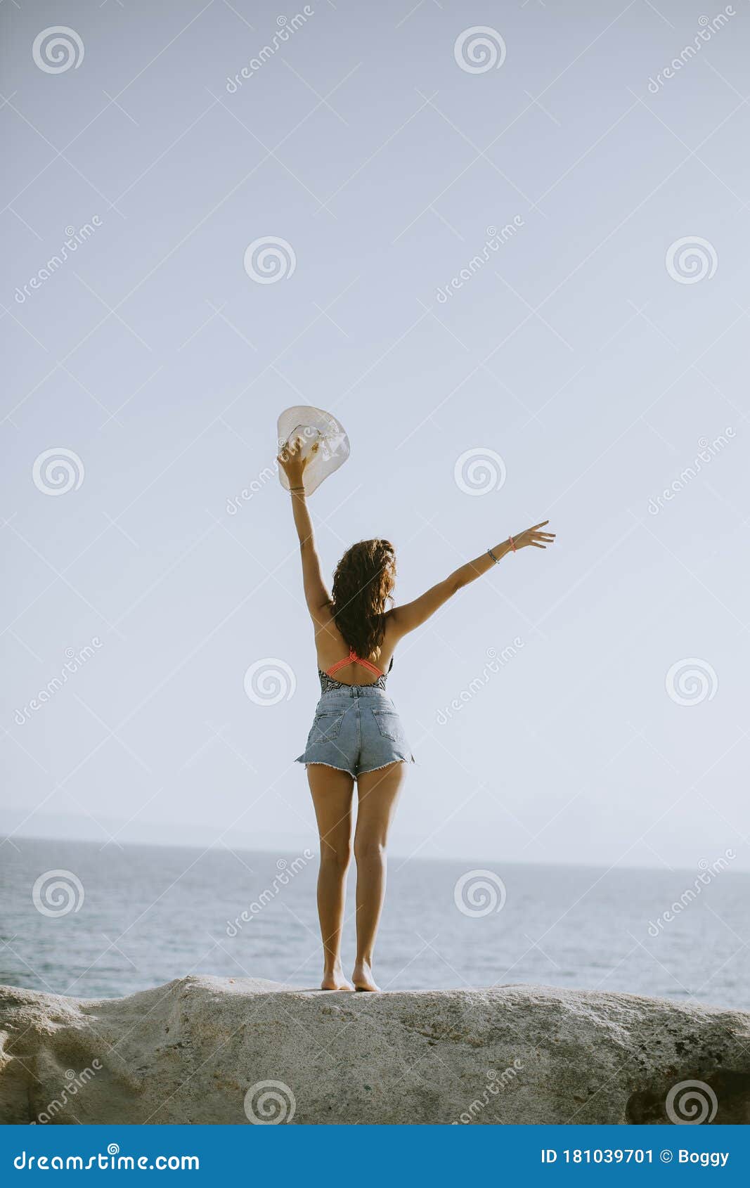 Young Woman In Bikini Standing On Rocks By The Sea Stock Image Image