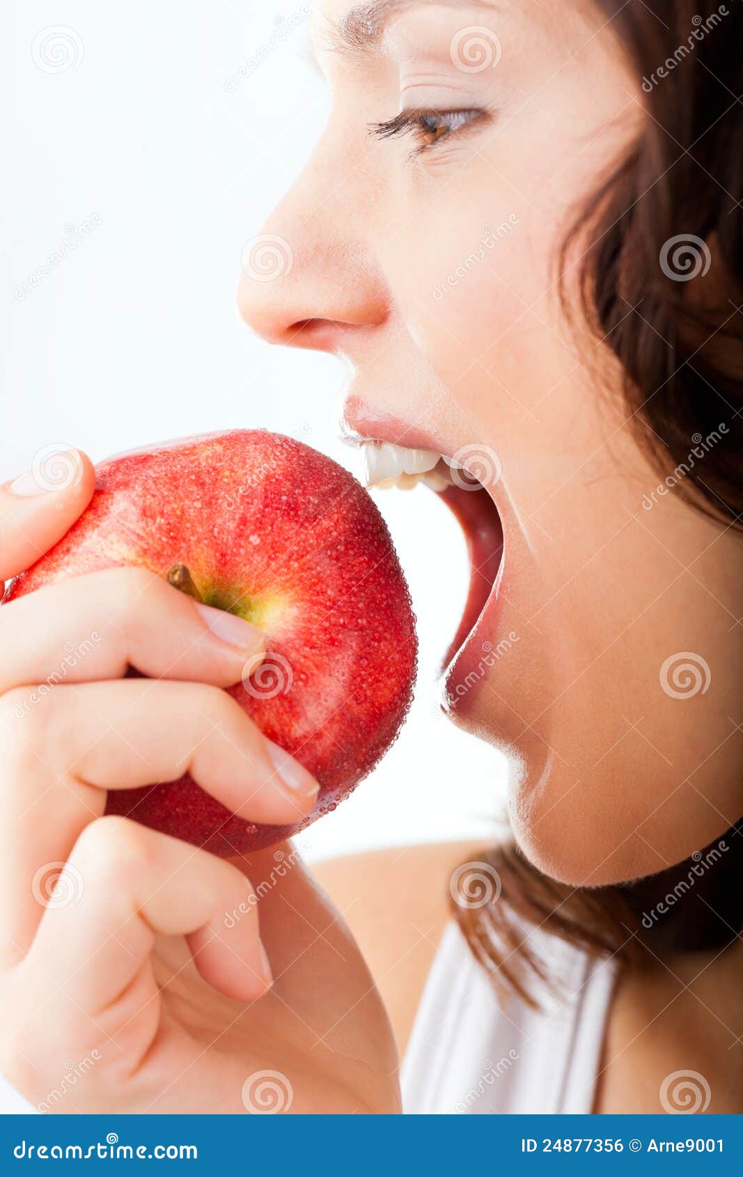 Young Woman Bites in a Apple Stock Photo - Image of smiling, shoot ...