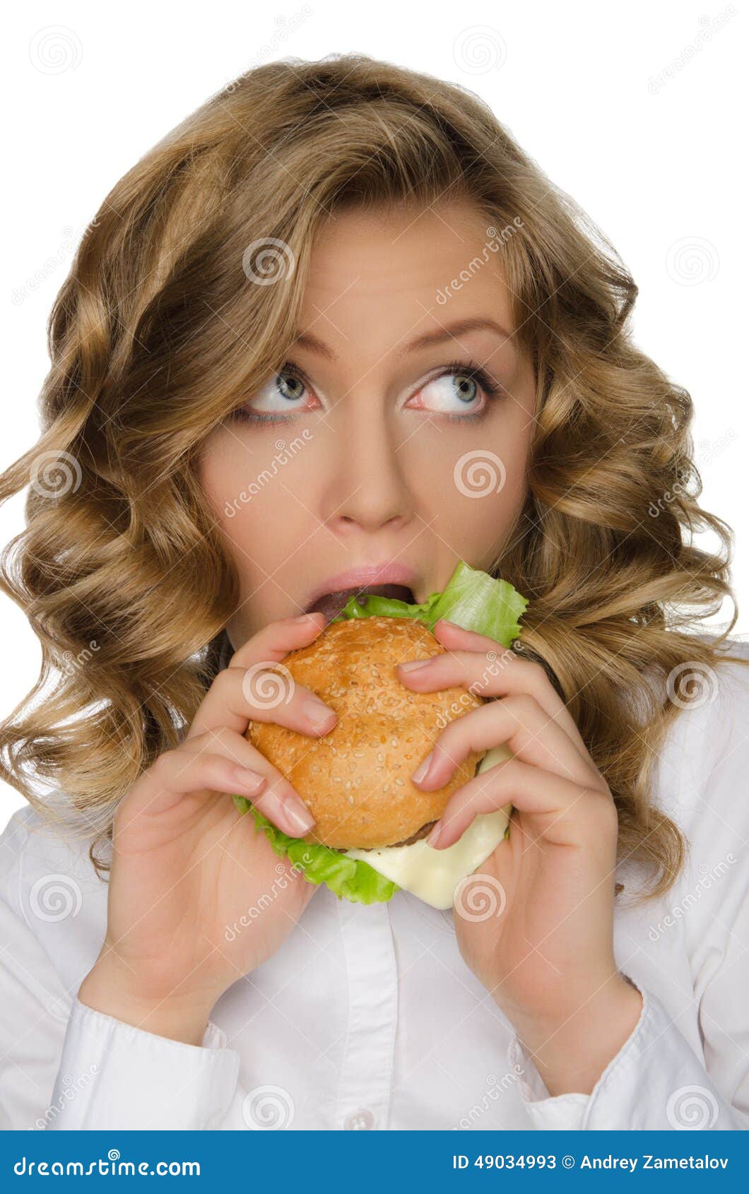 Young Woman Biting Burger and Looking Away Stock Image - Image of ...