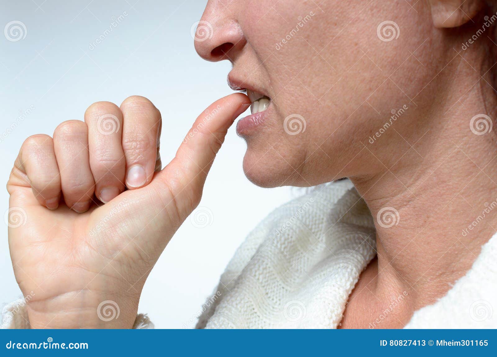 Young Woman Biting Her Thumb Nail Stock Image Image Of Cropped