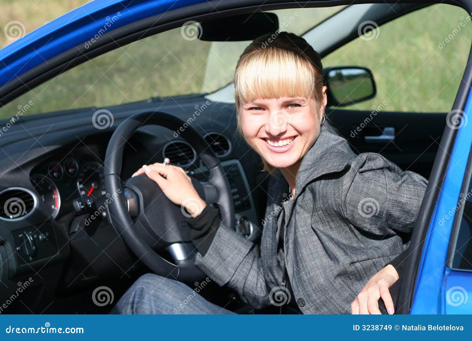 Young woman in a blue car stock image. Image of chrome - 3238749