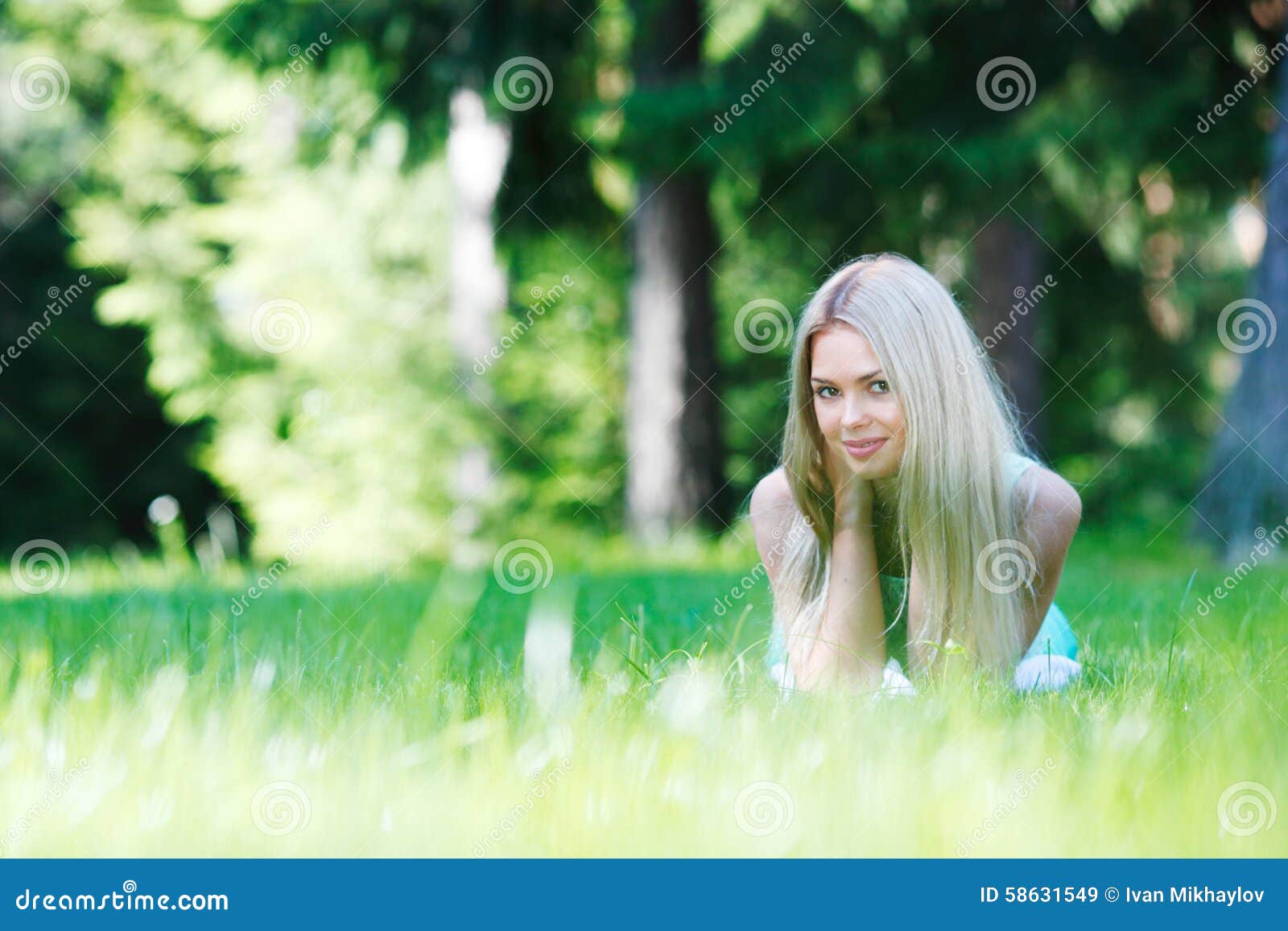 Young Woman In Blue Dress Lying On Grass Stock Image Image Of Smiling