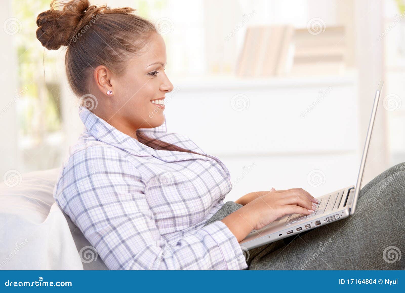 Young Woman Browsing Internet in Bed Smiling Stock Photo - Image of ...