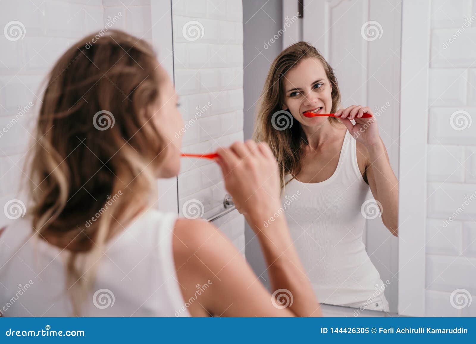 Young Woman Brushing His Teeth Front Of Mirror Stock Image Image Of