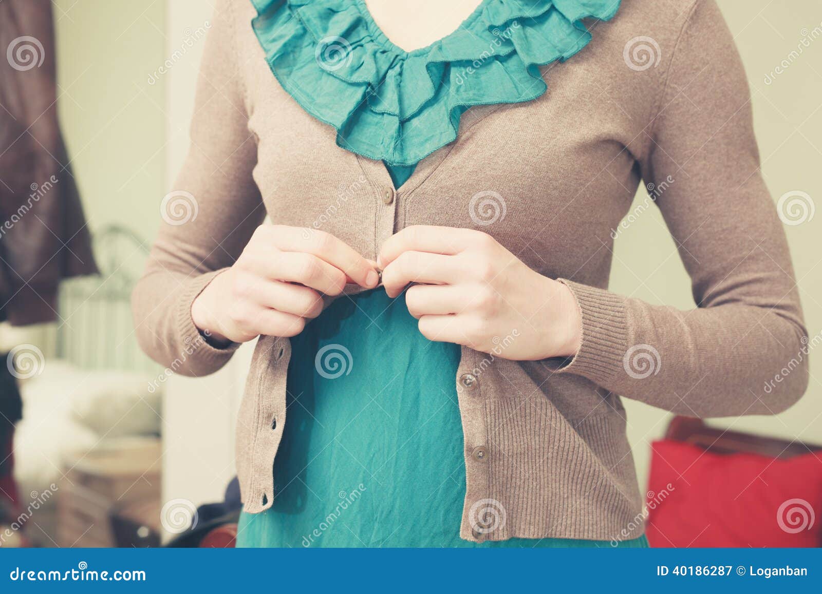 Young Woman Buttoning Her Blouse Stock Image - Image of cute, young ...