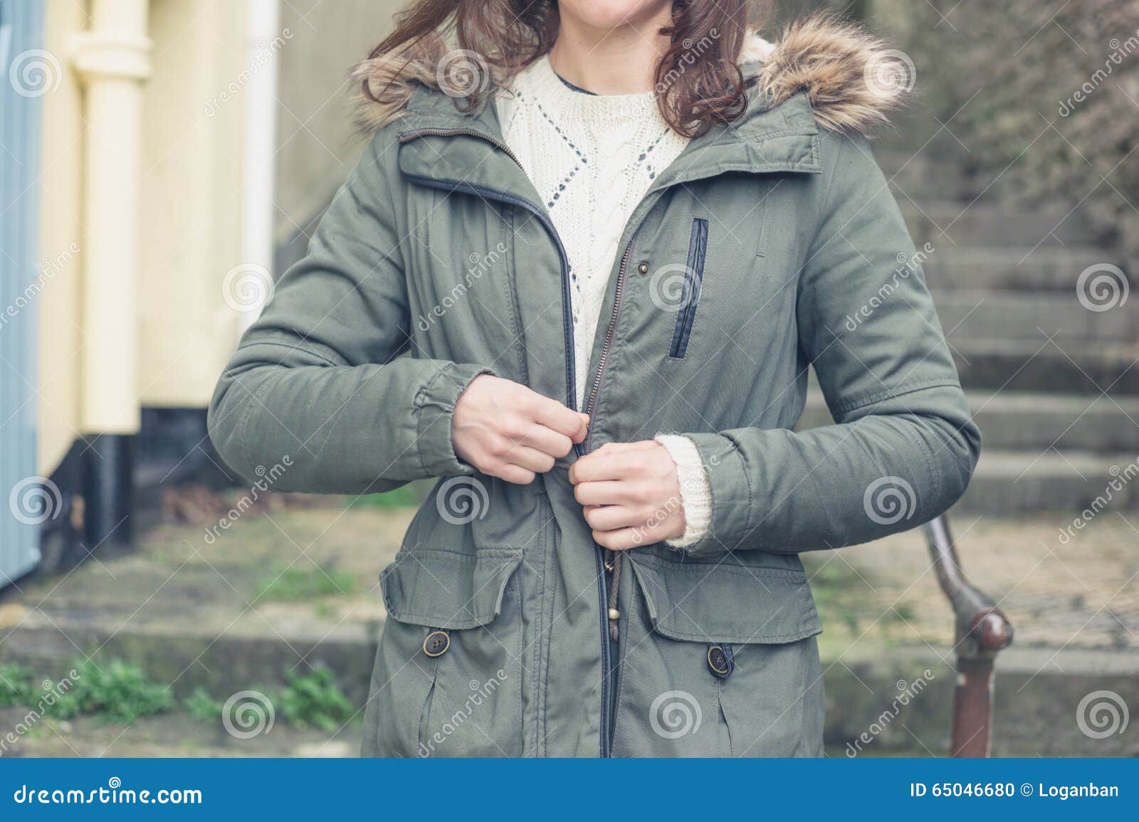 Young Woman Buttoning Her Coat Outside Stock Photo - Image of hands ...