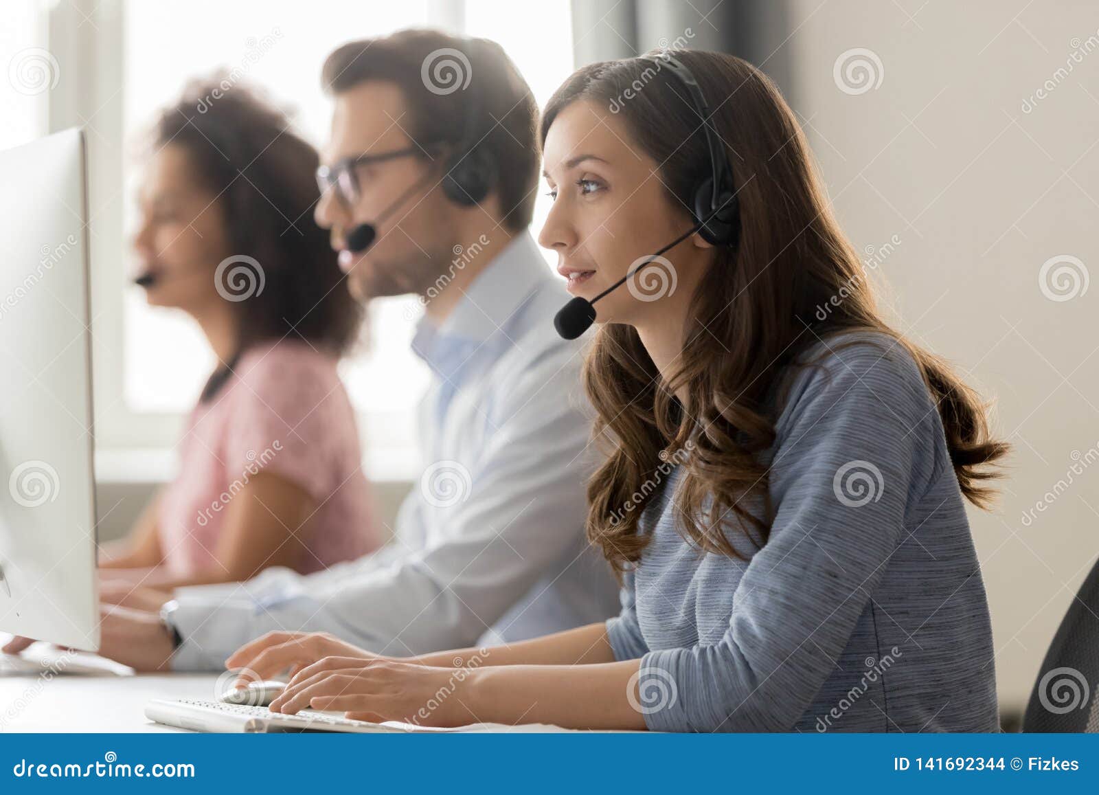 Young Woman Call Center Agent in Headset Consulting Online Client Stock ...