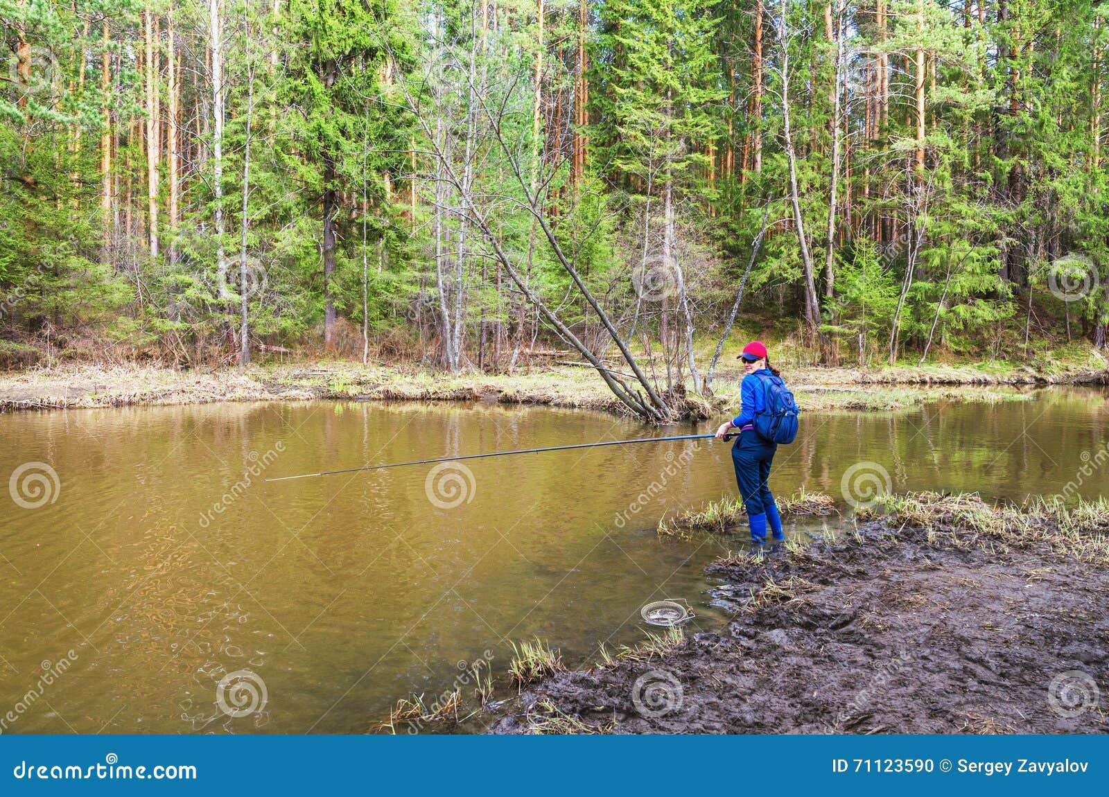 Young Woman Catches Fish in the Early Spring Stock Photo - Image of ...