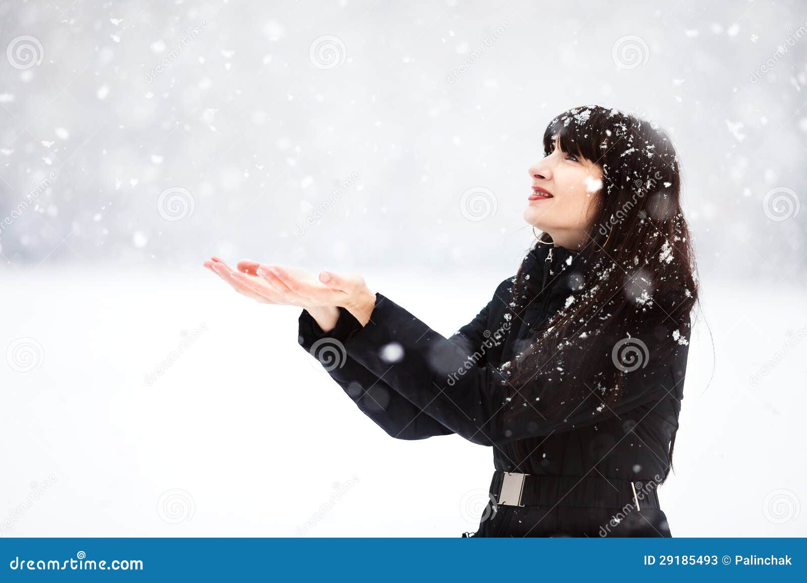 Young Woman Catches Snowflakes Stock Image - Image of fashion, holiday ...