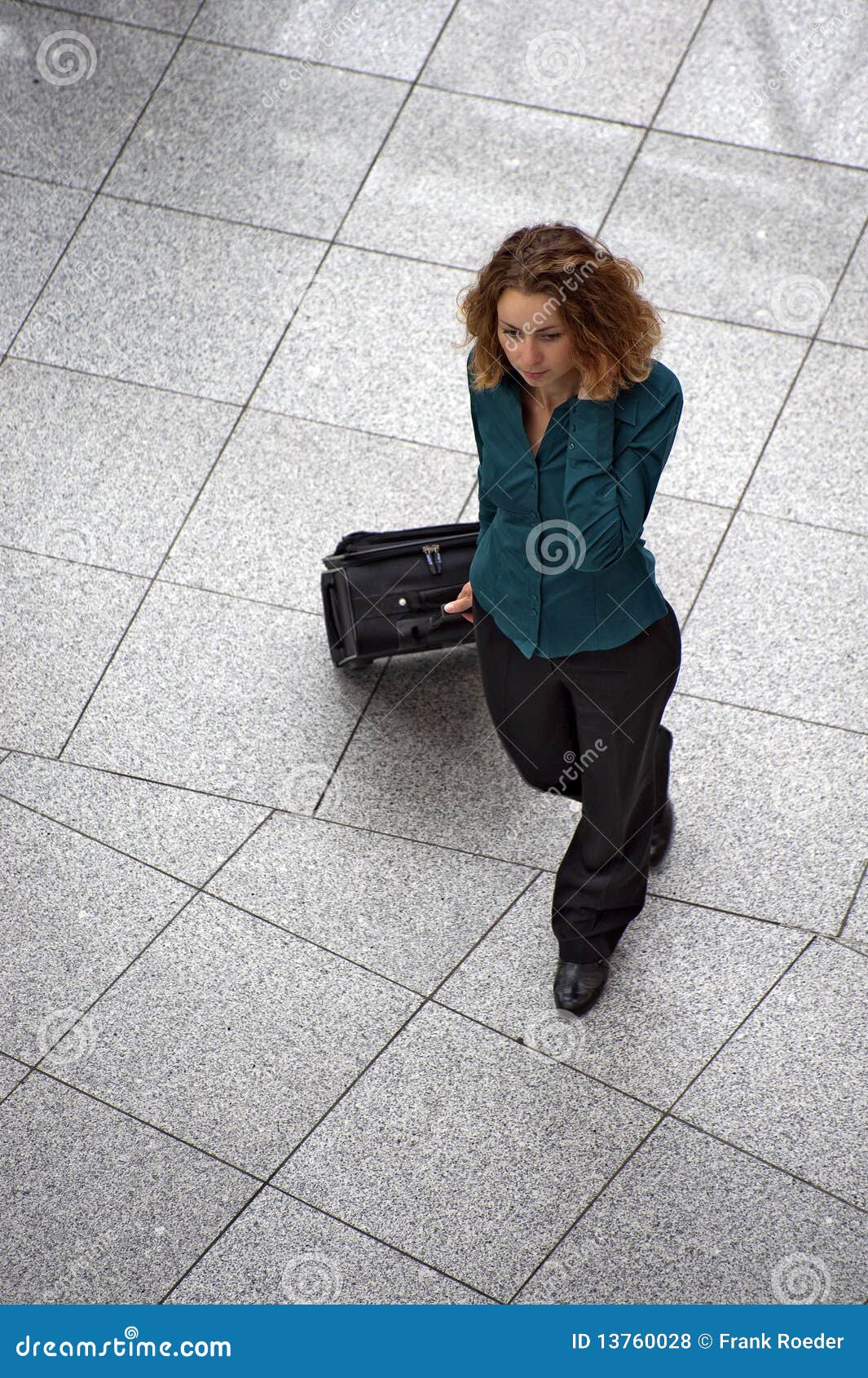 Young Woman with Cell Phone and Rolling Luggage Stock Photo - Image of ...