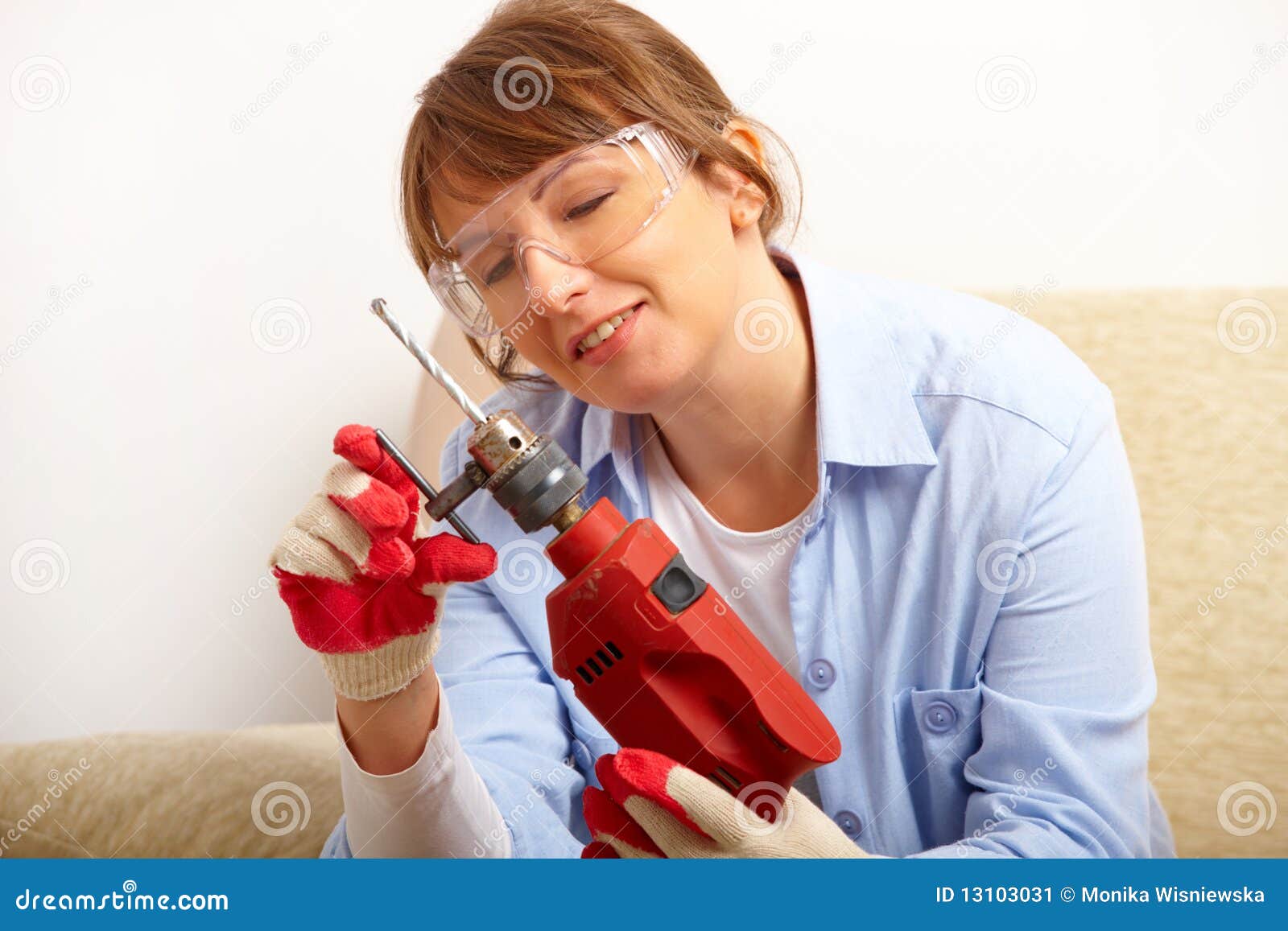 Young Woman Changing Drill Bit Stock Image - Image of happy, industry ...